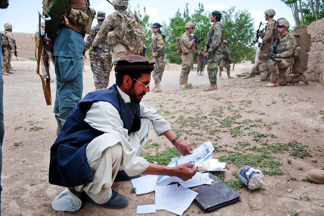 Fazel Rahman, left, the subgovernor of the Giro district in Afghanistan ...