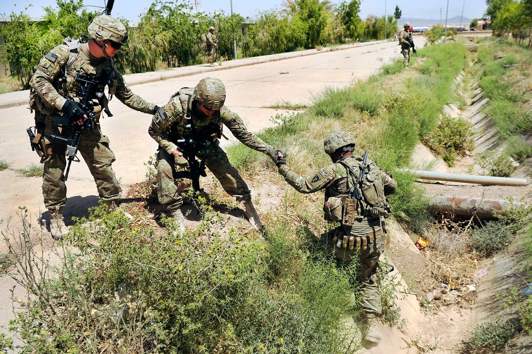 U.S. Army Sgt. Jacob LoMonaco, left, and U.S. Army Staff Sgt. Daniel ...