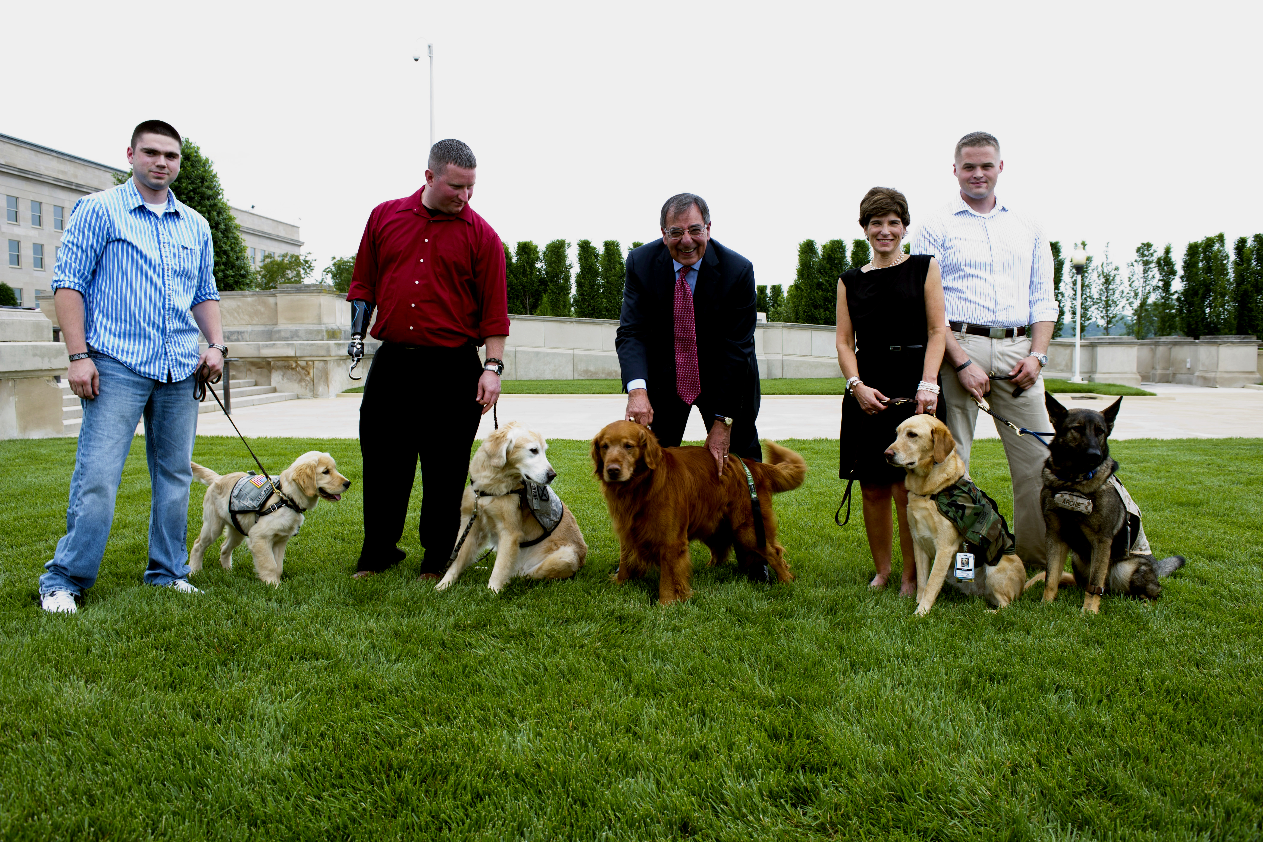 Defense Secretary Leon E. Panetta and his dog, Bravo, center, pose for ...