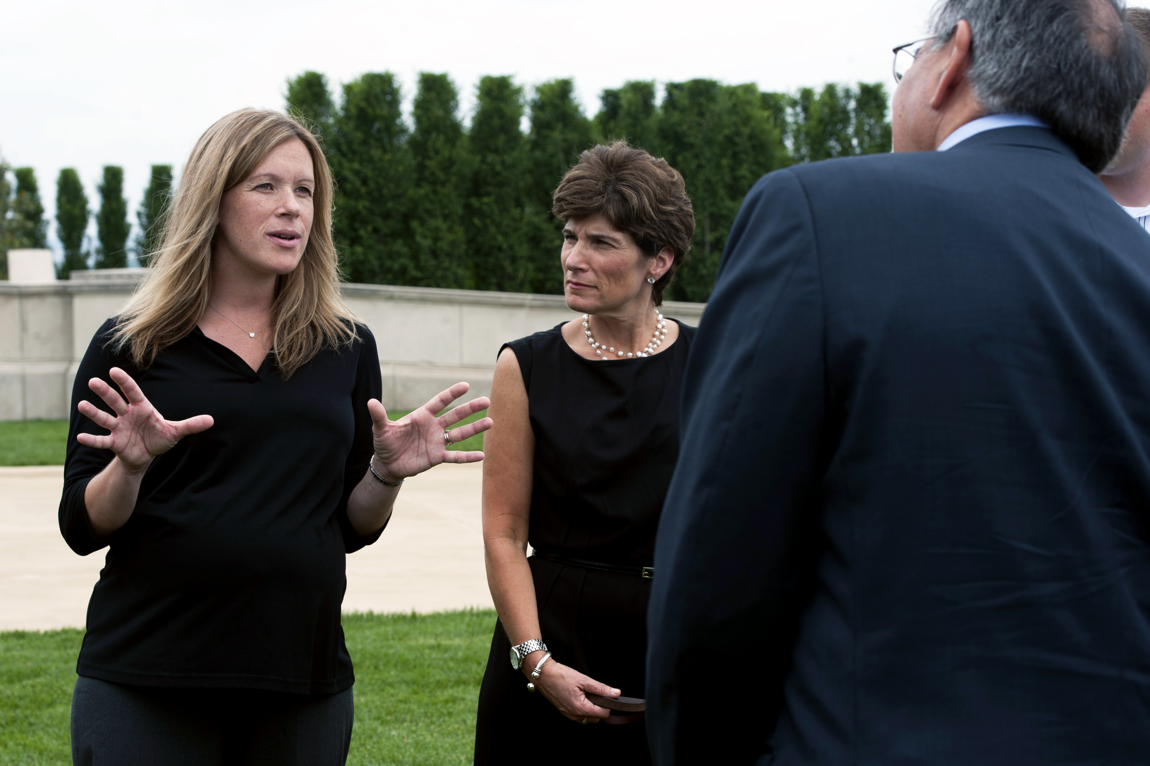 Defense Secretary Leon E. Panetta speaks with Sara Hook, director of ...