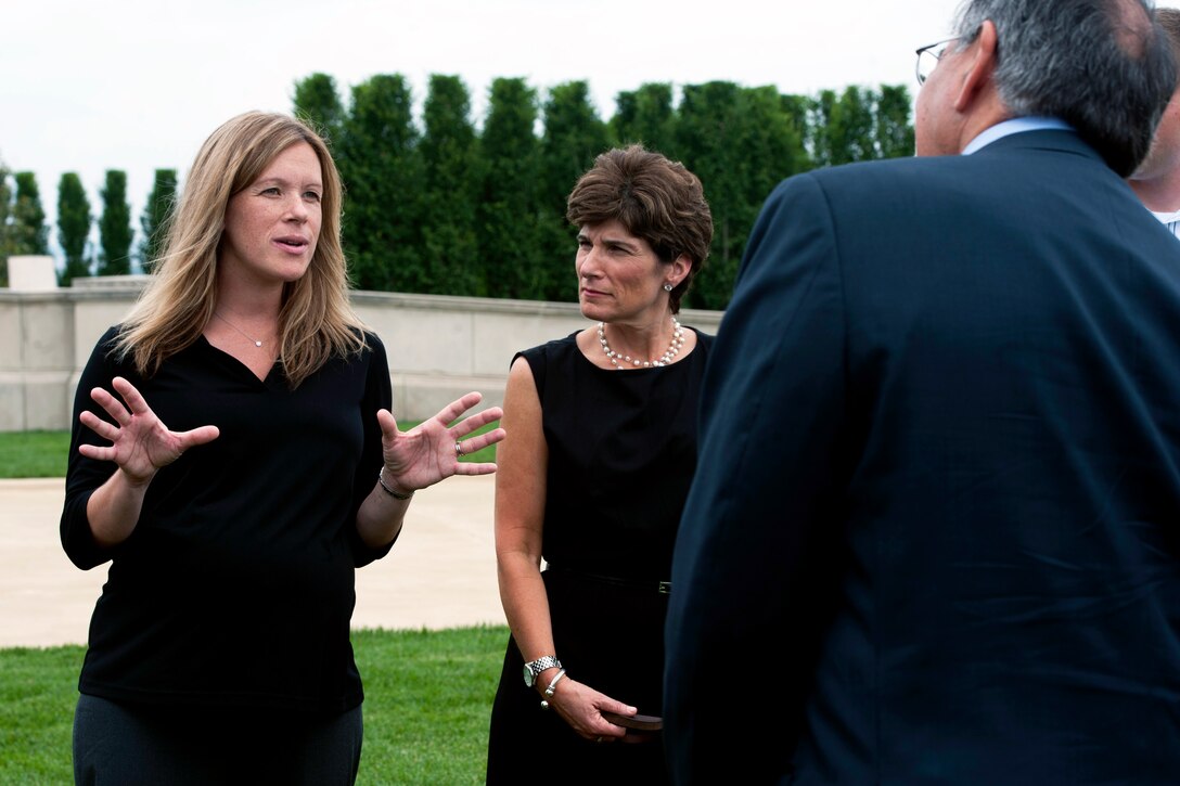 Defense Secretary Leon E. Panetta speaks with Sara Hook, director of ...