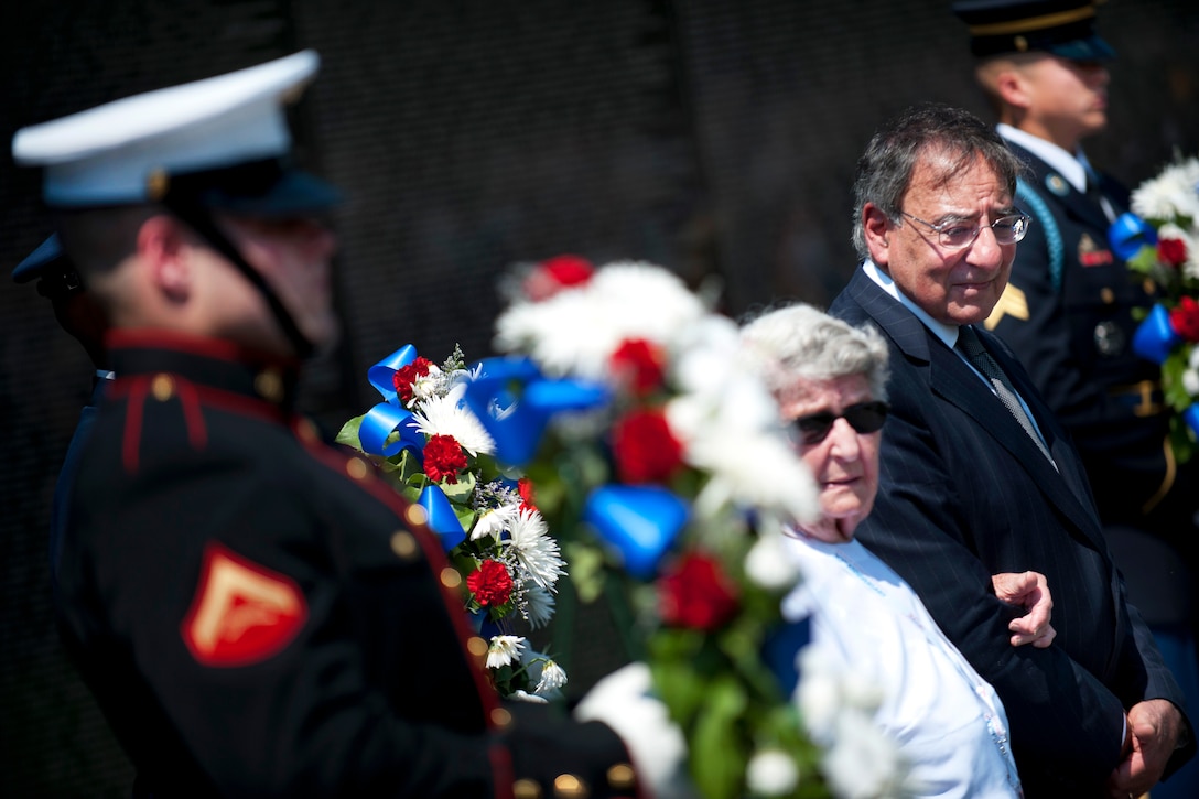 Defense Secretary Leon E. Panetta escorts 93-year-old Sarah Shay to lay ...