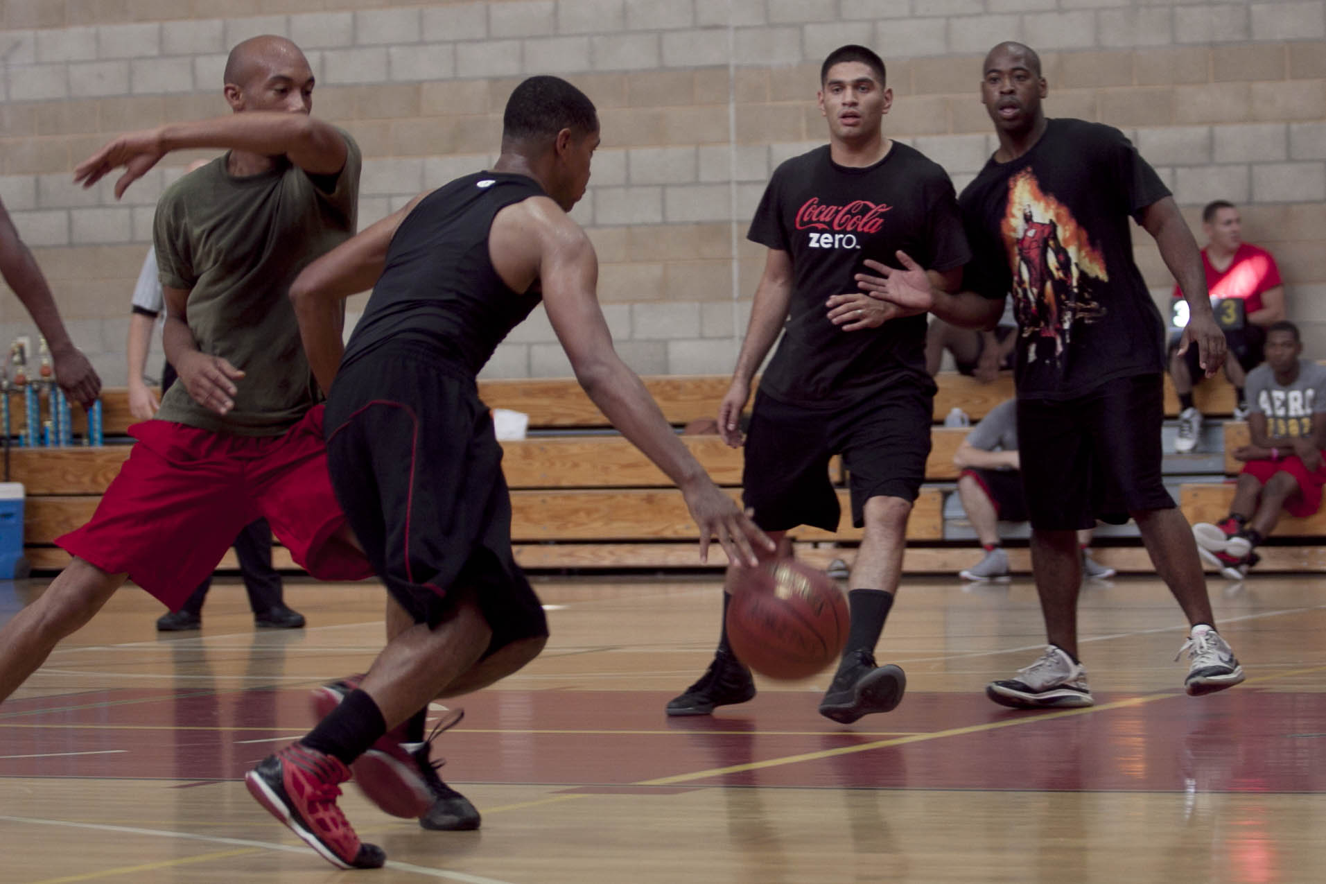 Service members shoot hoops on base