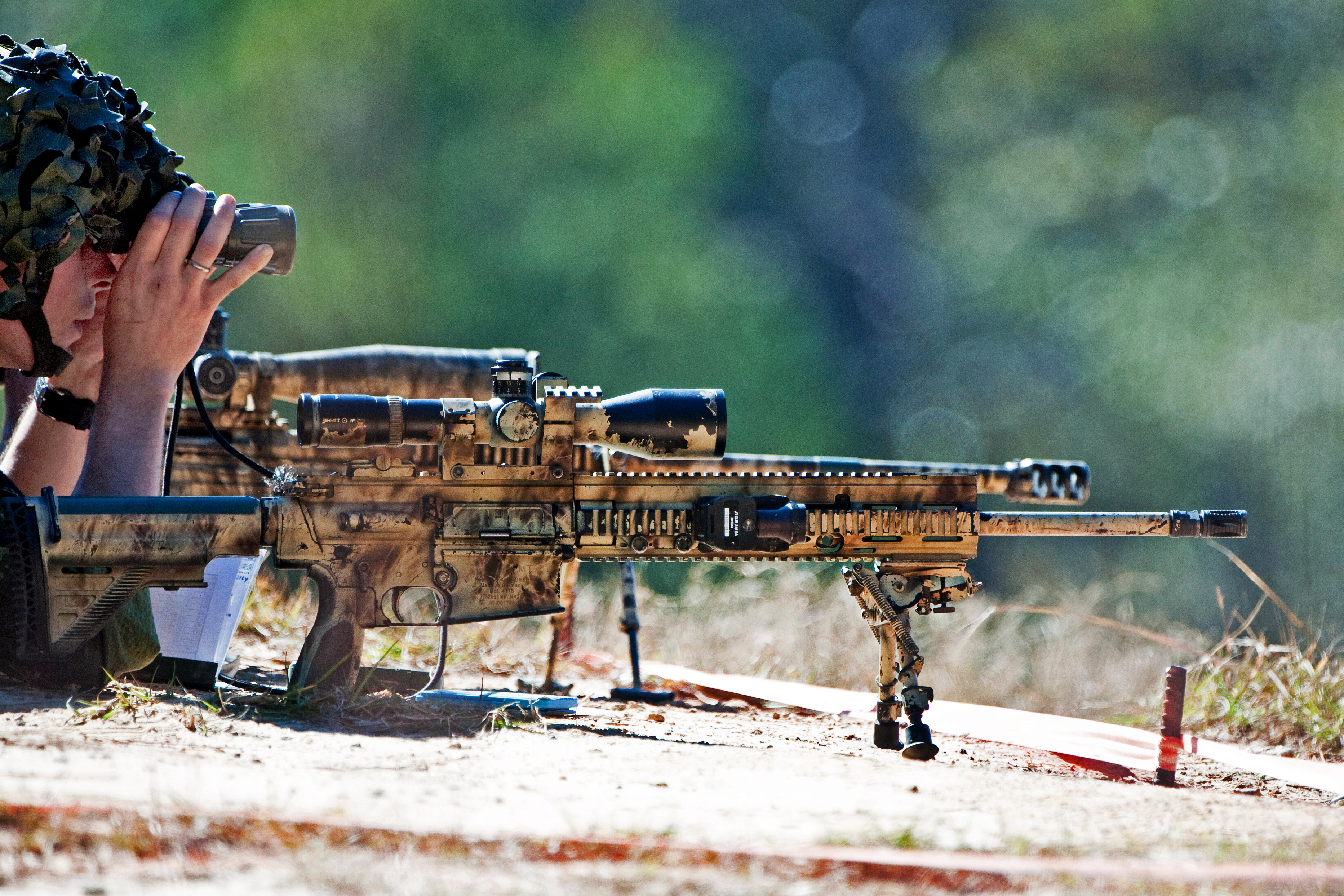 From the spotter position, Nick Brorsen helps sniper teammate Michael ...