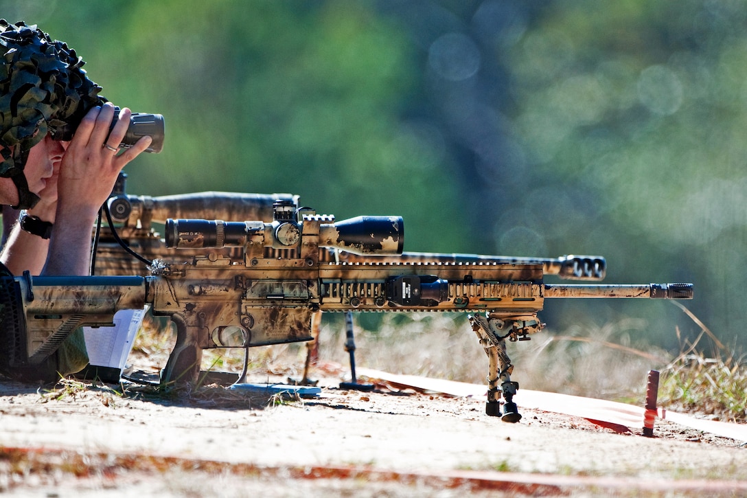 From the spotter position, Nick Brorsen helps sniper teammate Michael ...
