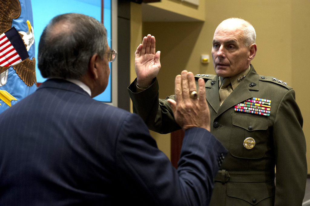 Defense Secretary Leon E. Panetta, left, administers the oath of office ...