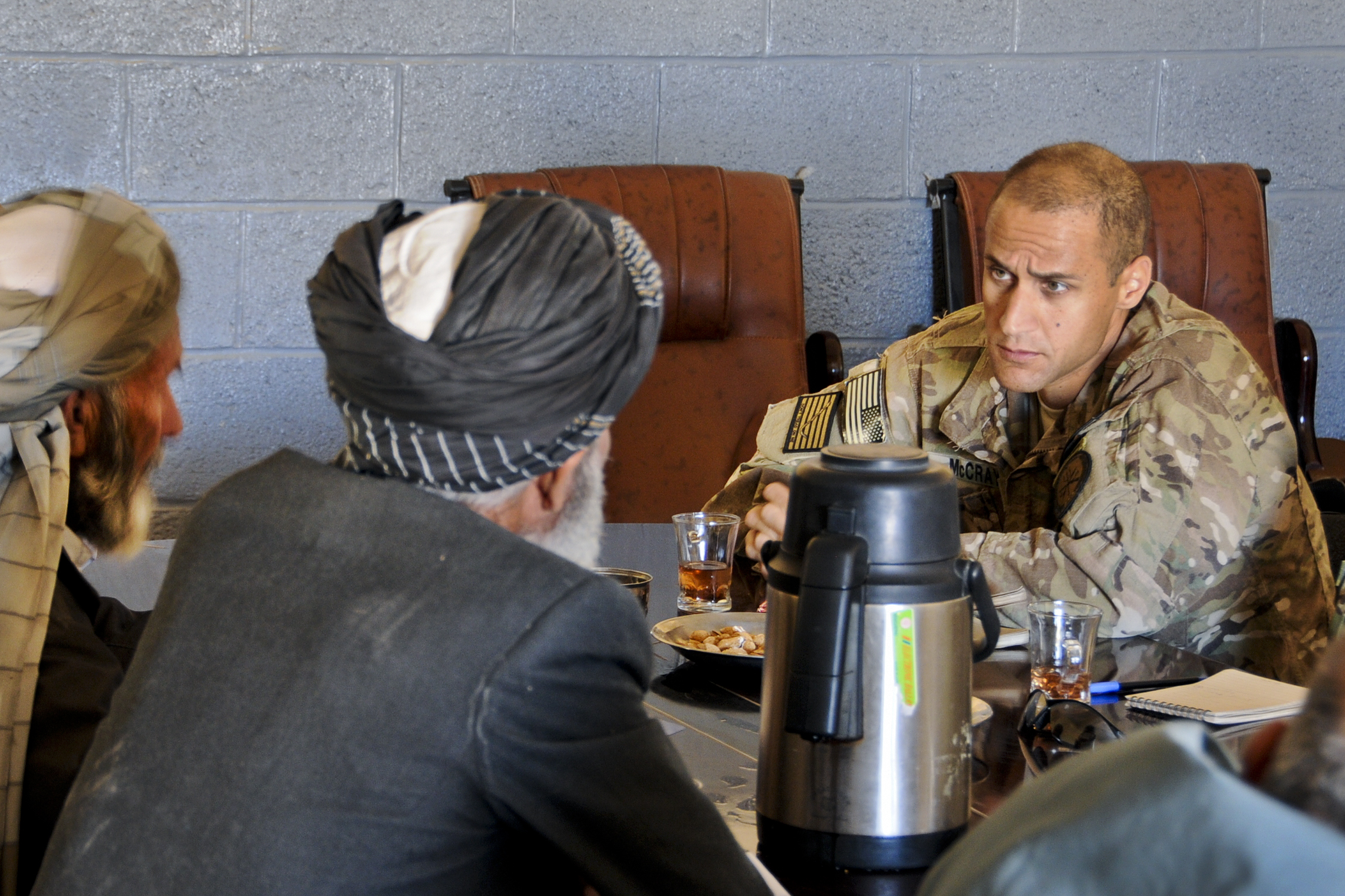 U.S. Navy Cmdr. Louis McCray, right, listens to district government ...