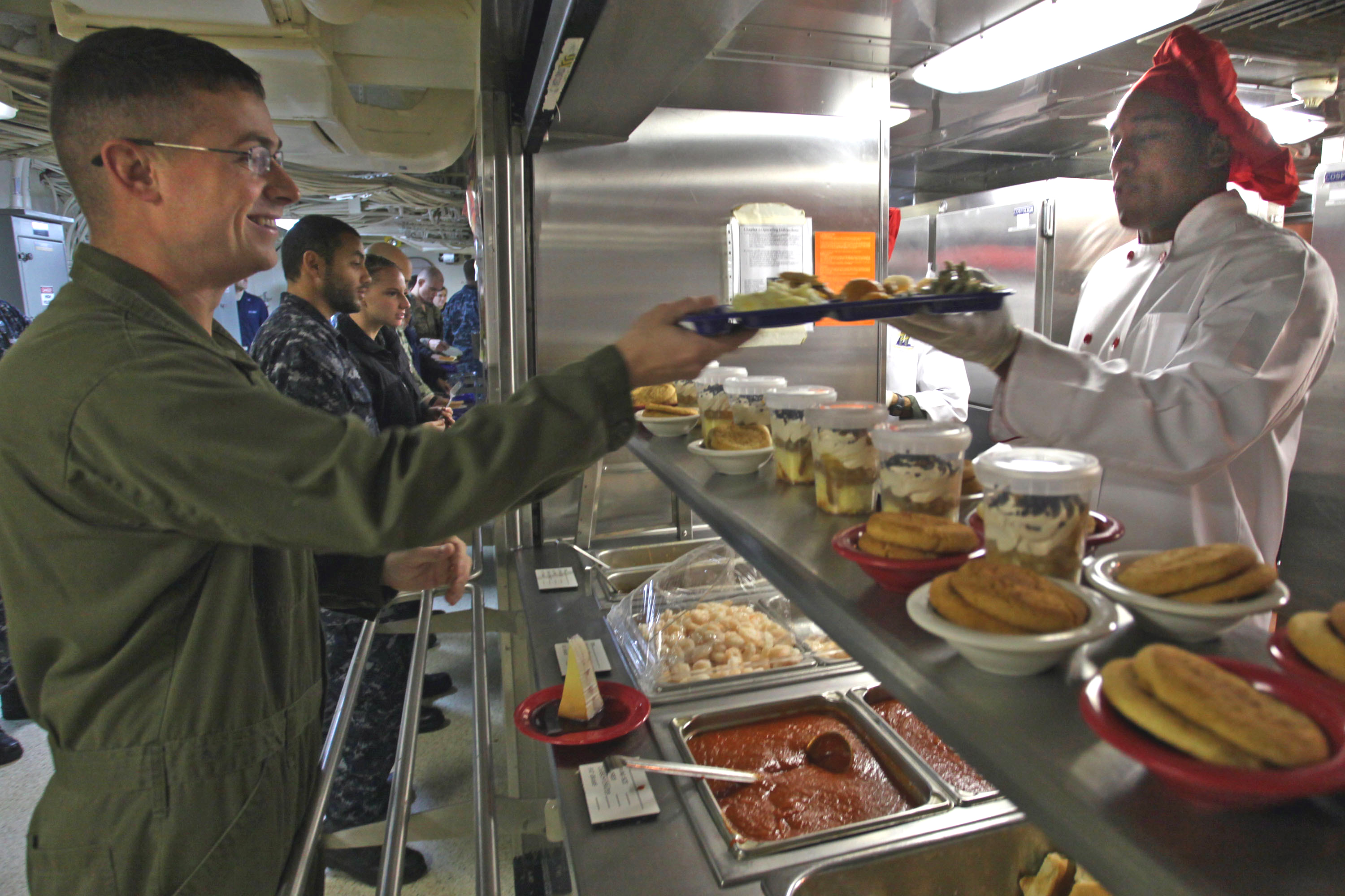 U.S. Marine Corps Staff Sgt. Walter Duncan, left, receives a ...