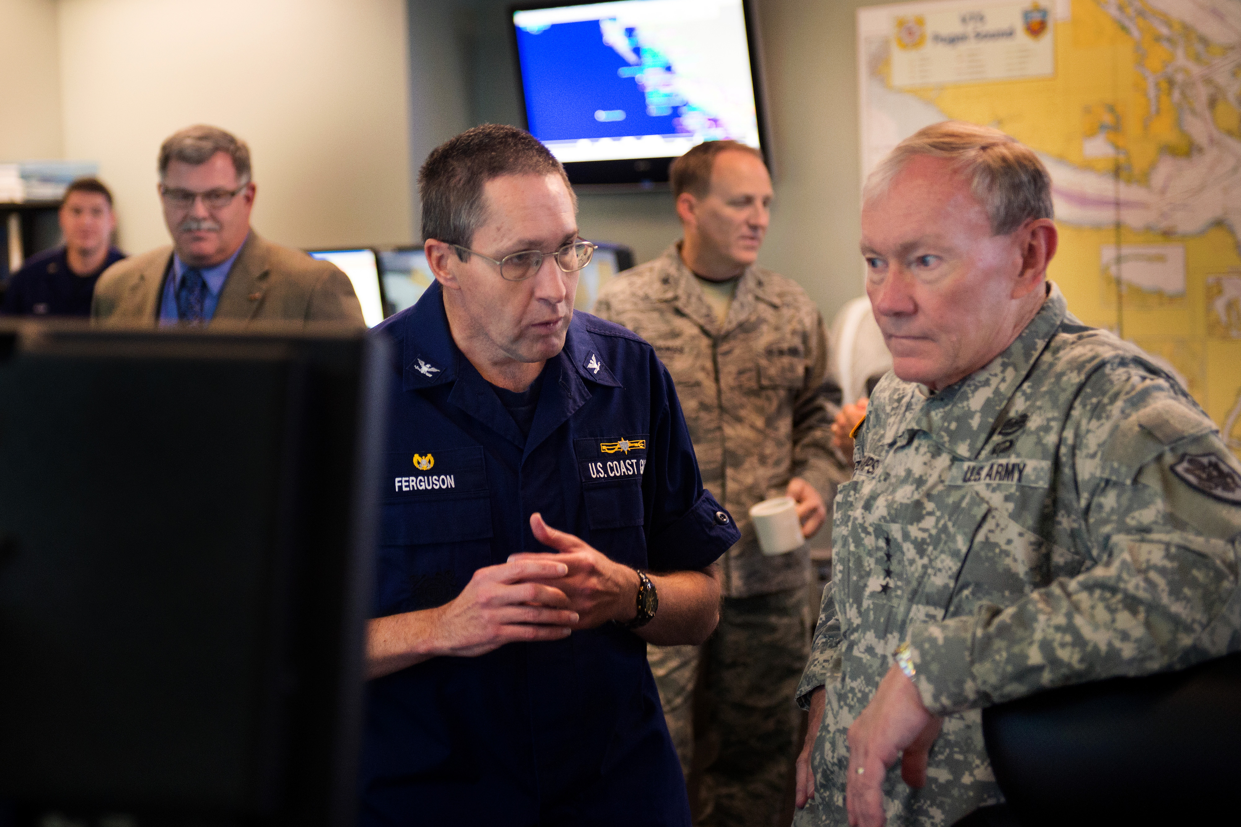 Coast Guard Cpt. Ferguson, left, briefs Army Gen. Martin E. Dempsey ...