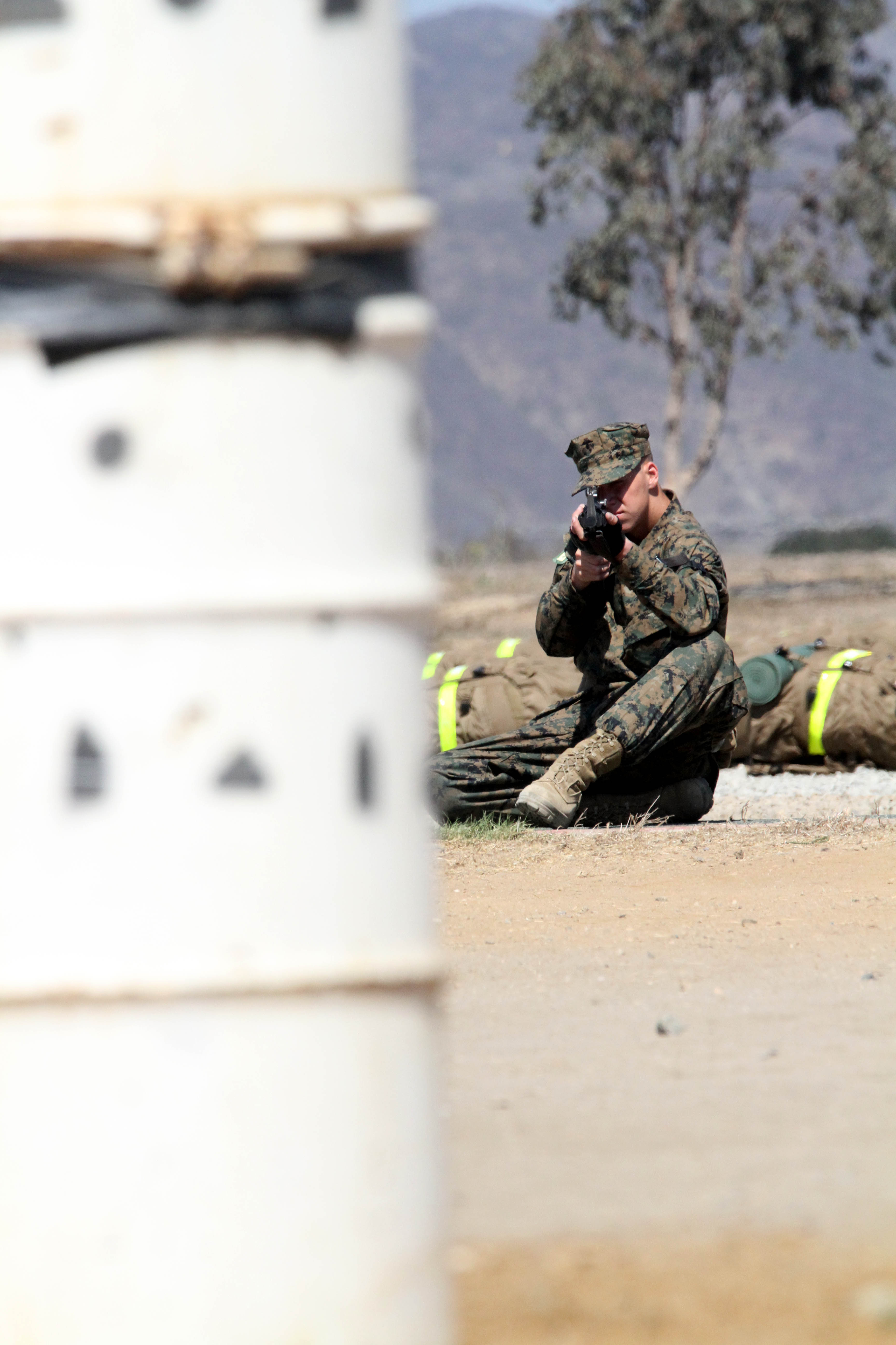 A white barrel with different targets painted on it allows recruits to ...