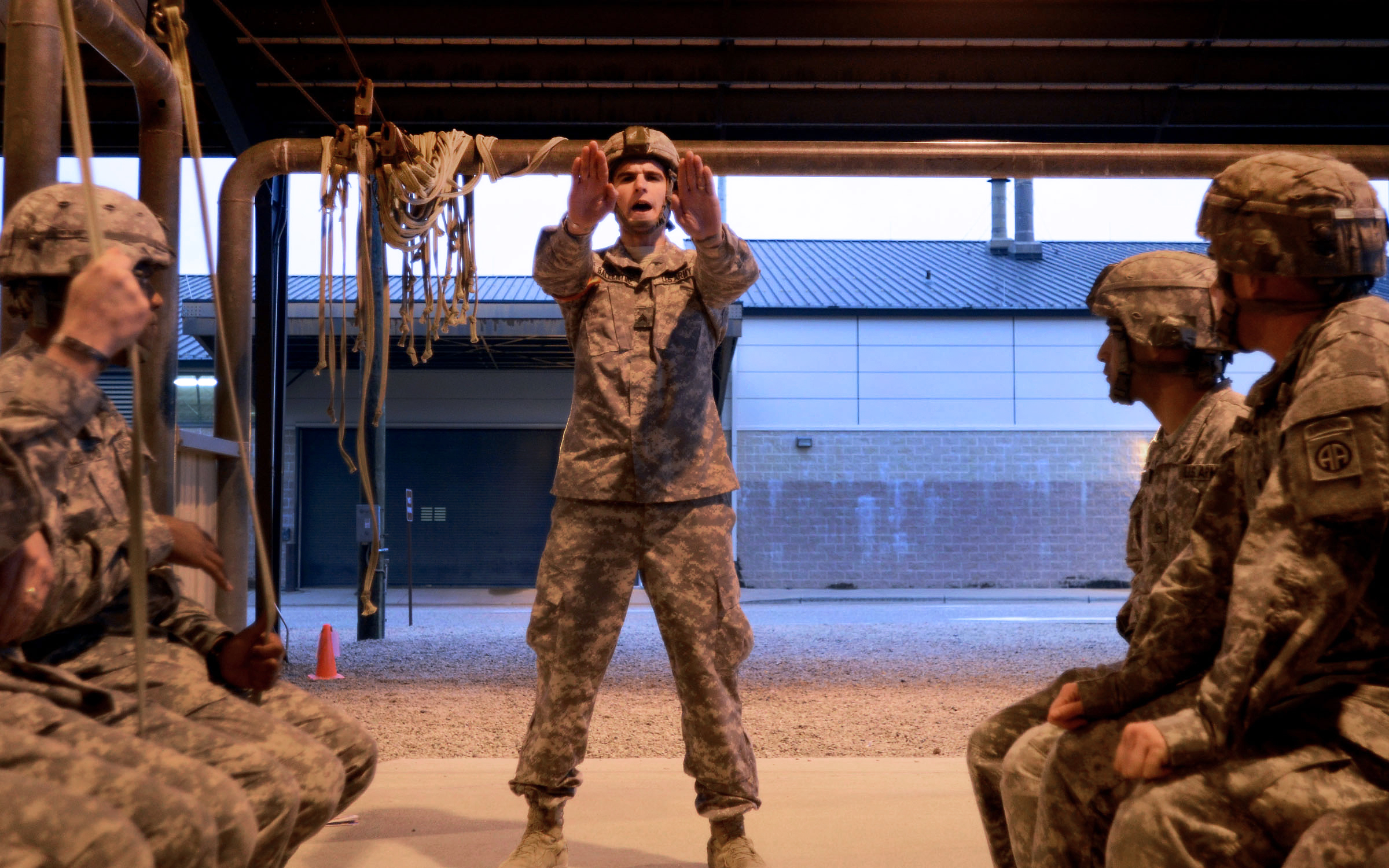 Army Sgt. Cory Ballentine conducts mock-door training for his ...