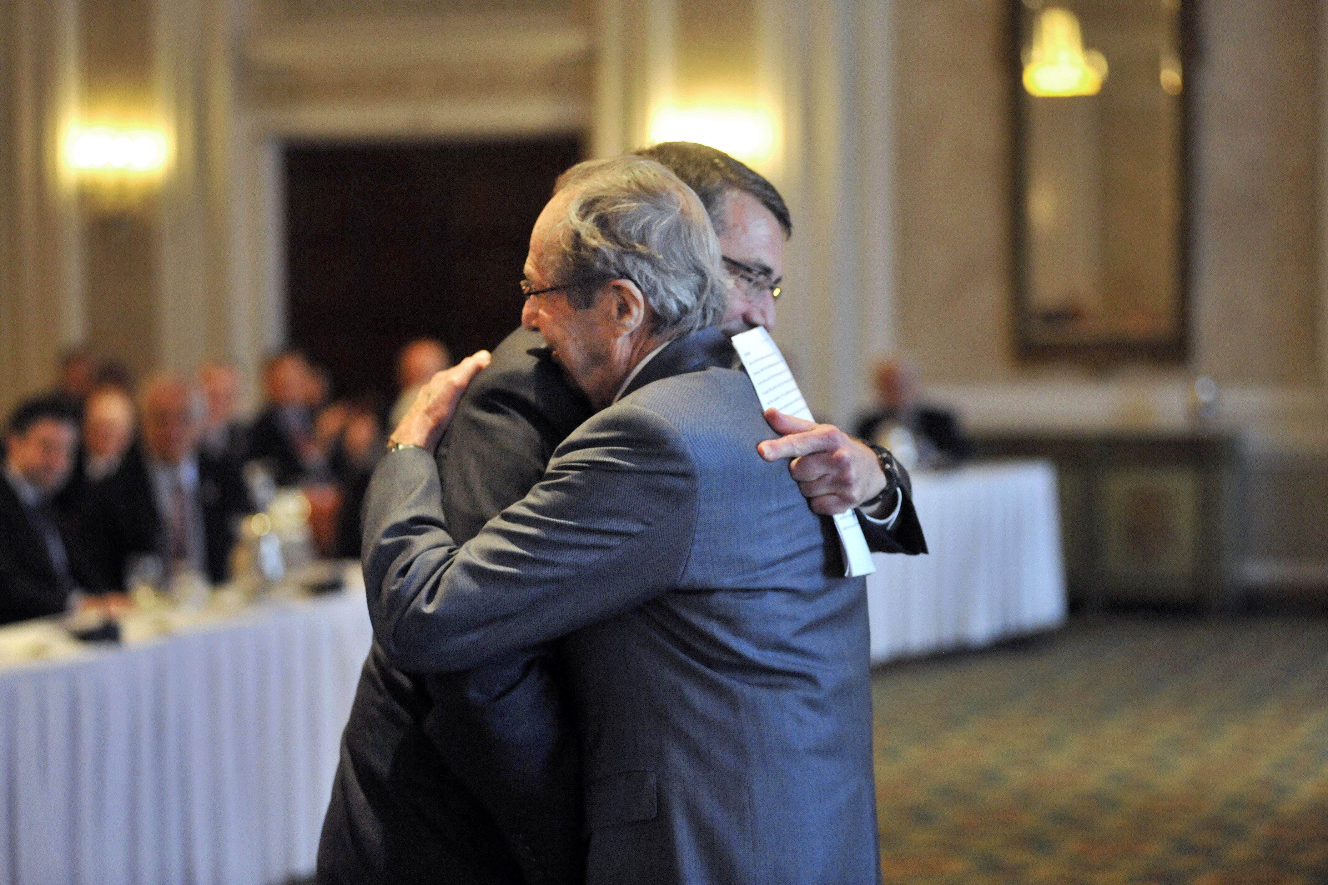 U.S. Deputy Defense Secretary Ashton B. Carter, left, embraces former U ...