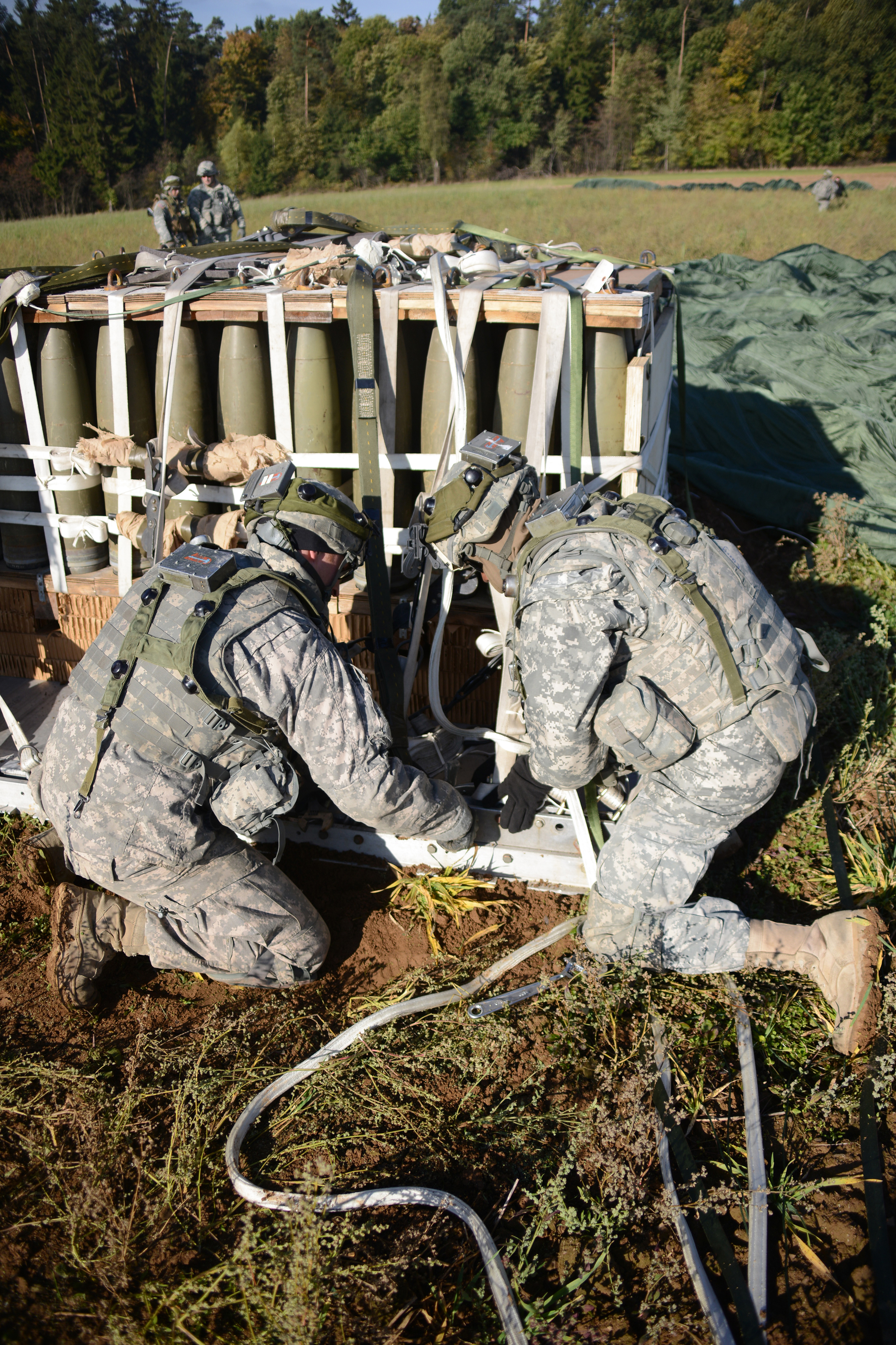 U.S. Army soldiers perform heavy-load drop recovery operations during ...