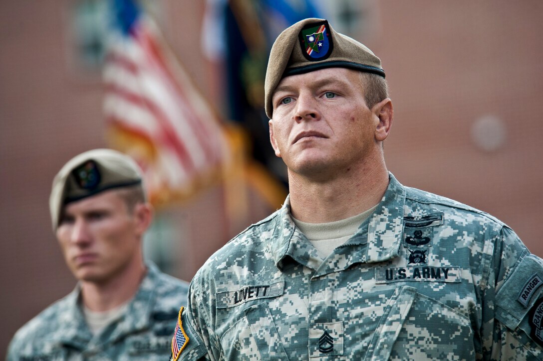 Army Sgt. 1st Class James Lovett stands in formation during an award ...