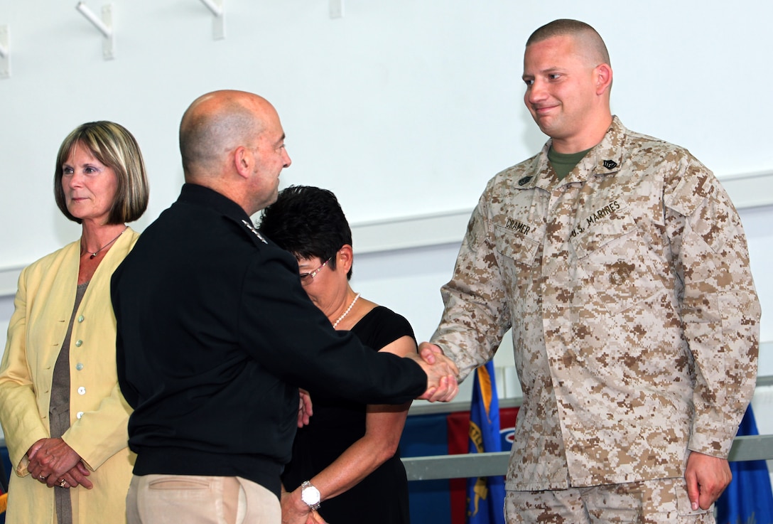Gunnery Sgt. Cramer Gets Coin from Admiral Stavridis