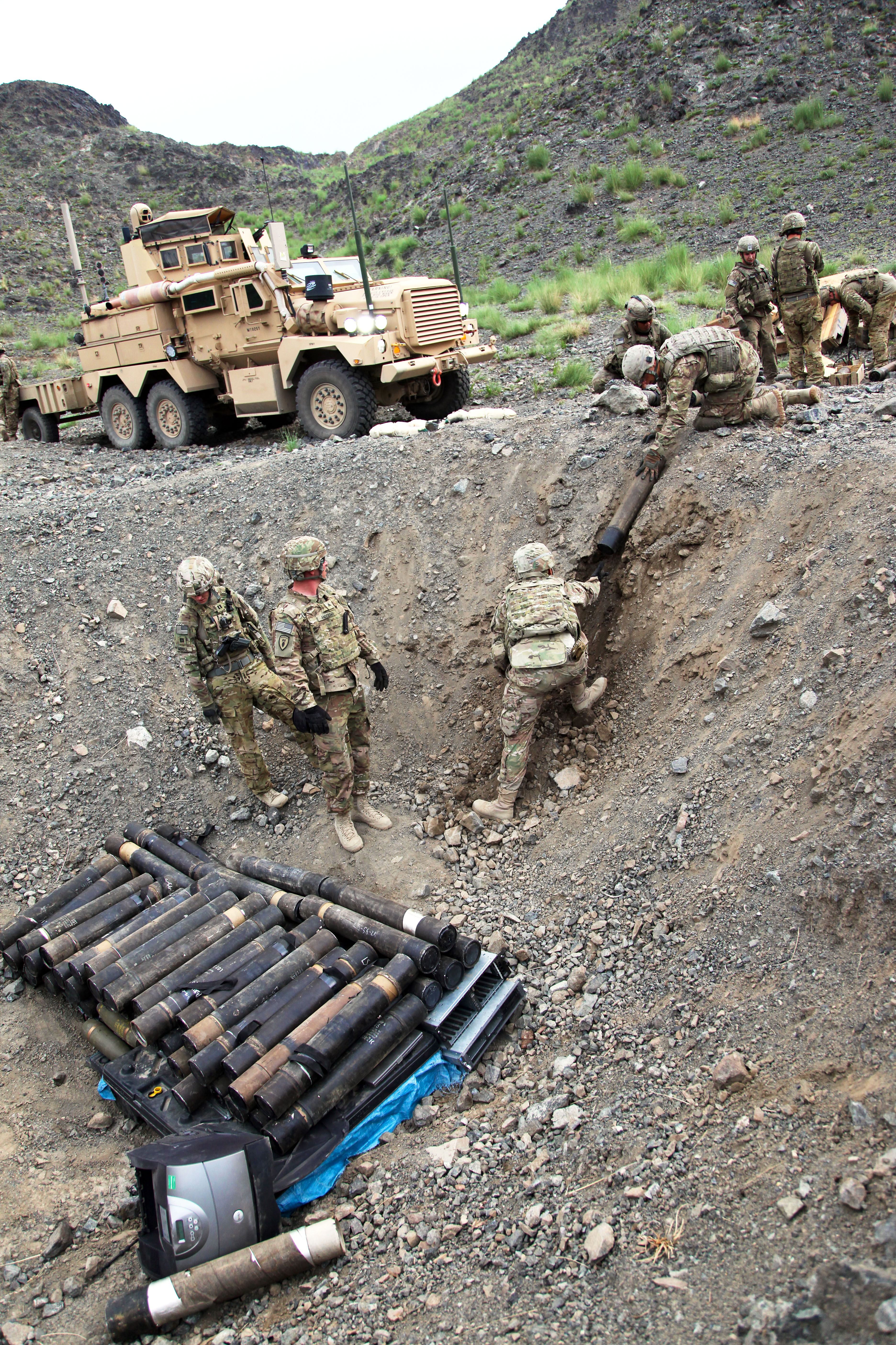 U.S. soldiers position equipment slated for destruction at the ...