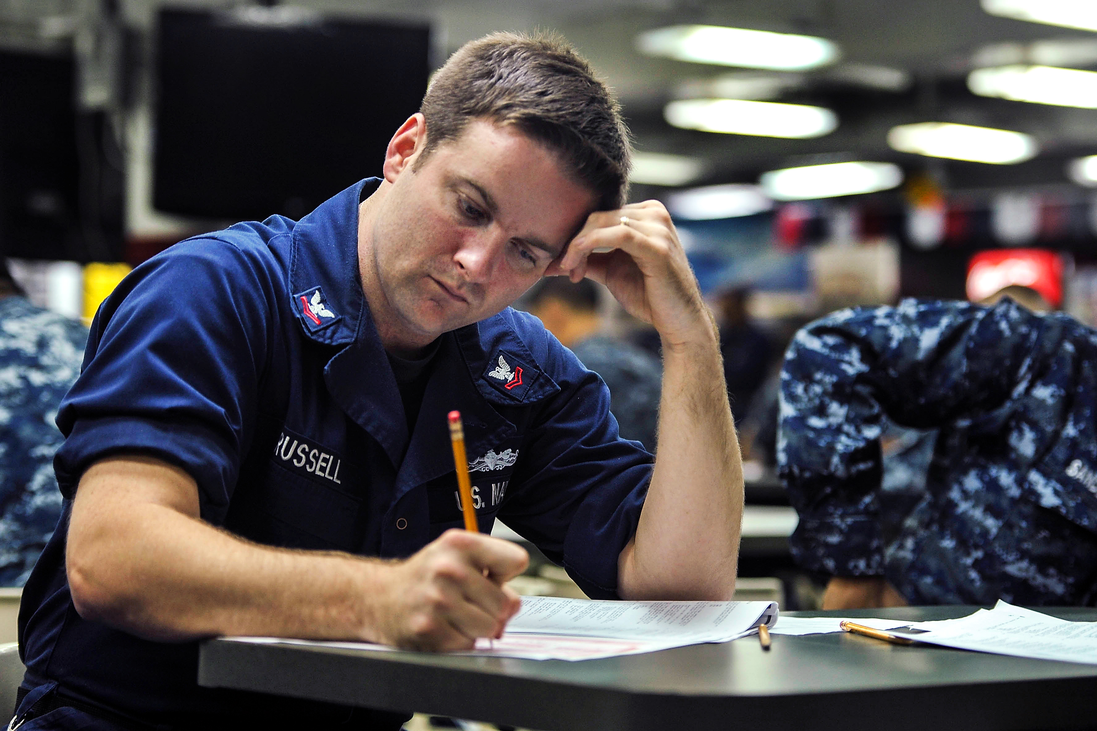 U.S. Navy Petty Officer 2nd Class Michael Russell takes the Petty ...