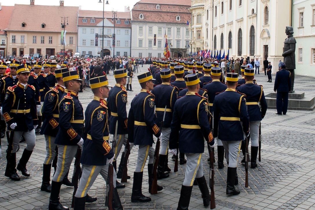 Romanian soldiers perform during the opening ceremony for the NATO ...