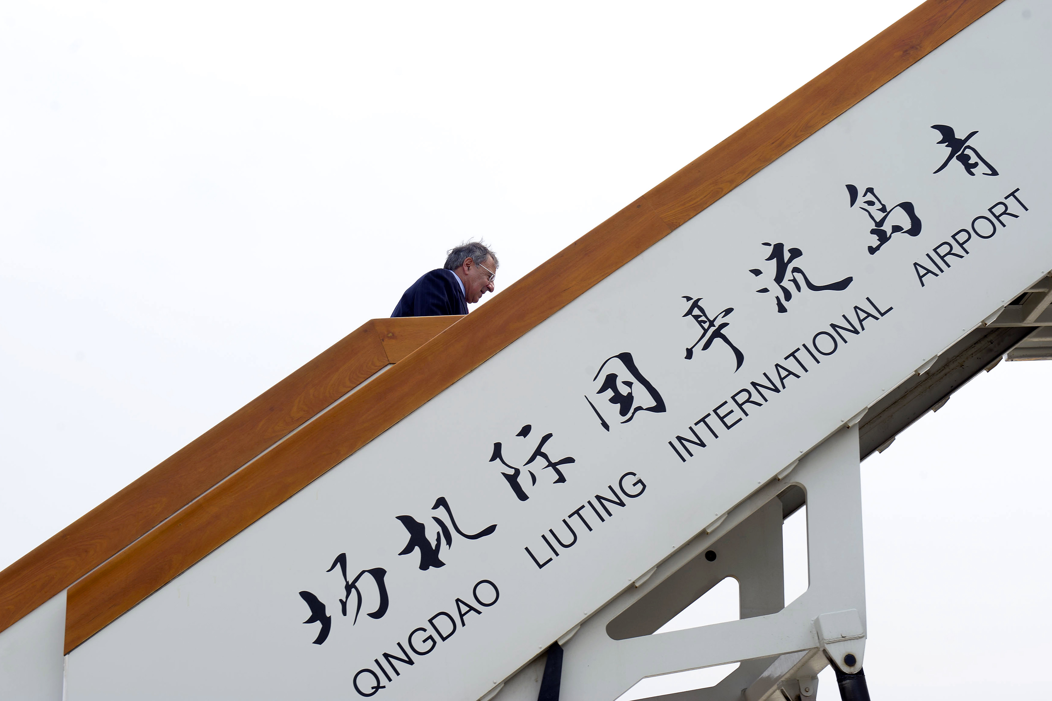 U.S. Defense Secretary Leon E. Panetta boards an U.S. Air Force E4-B ...