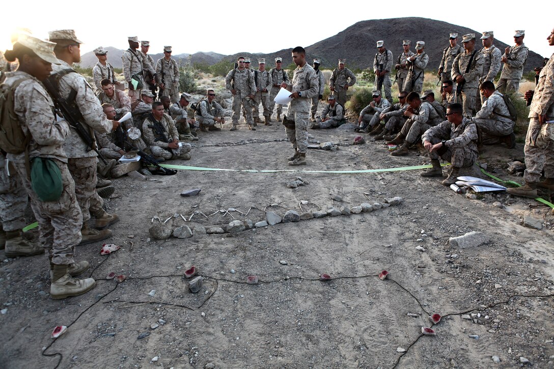 Marine Corps 1st Lt. Alex Jabbal gives his Marines a mission brief ...