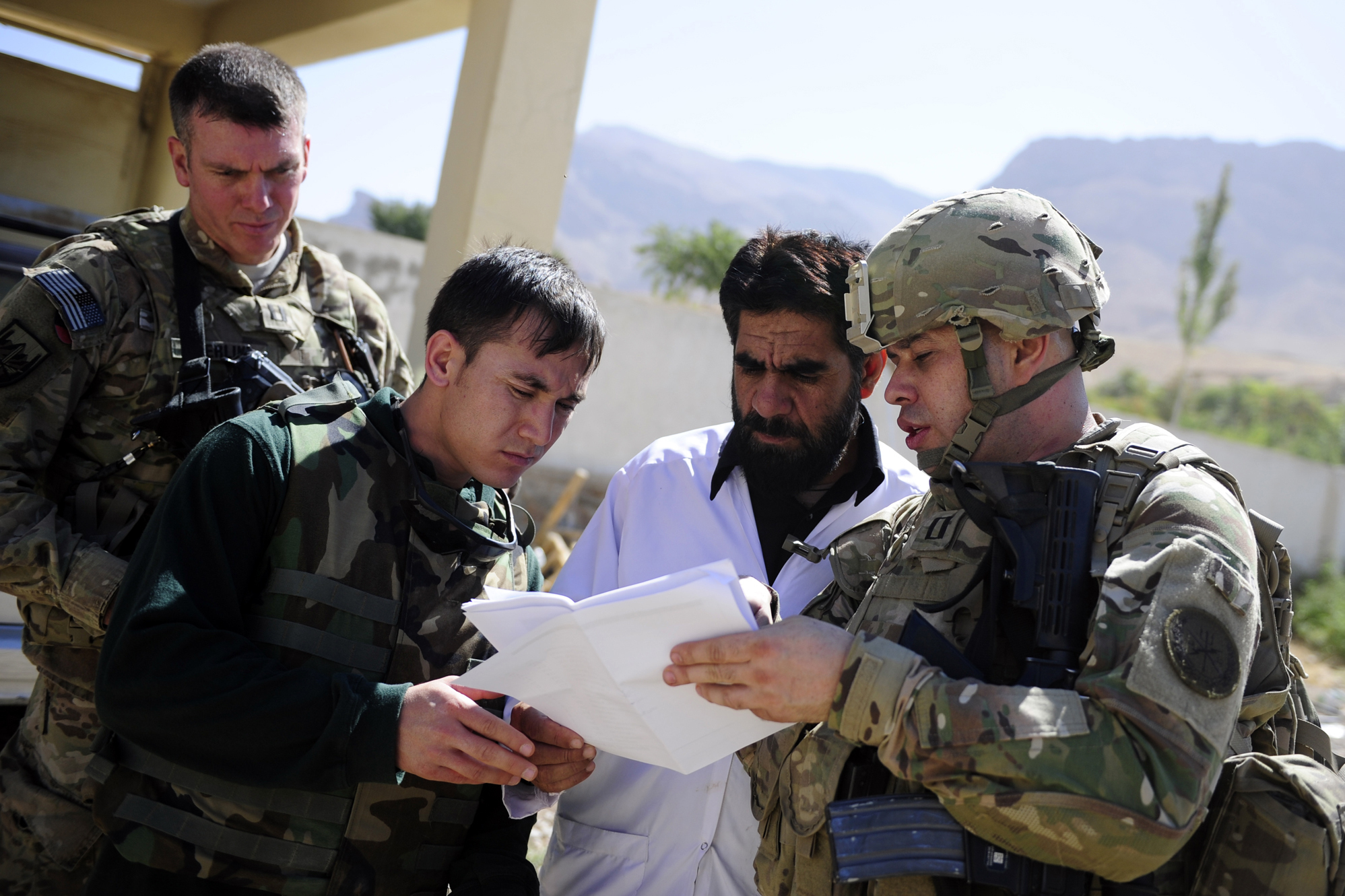 U.S. Navy Lt. Jerry Mojzis, right, and Lt. David Berlin go over design ...