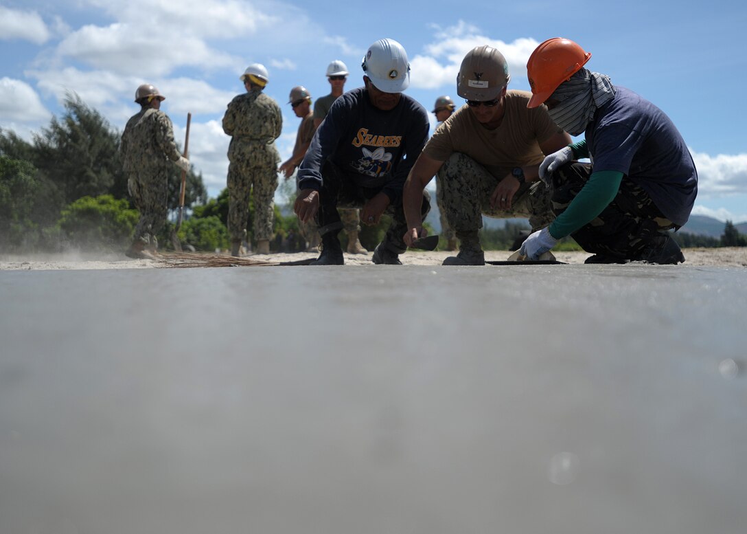 130326-N-VN372-018 ZAMBALES, Philippines – (March 26, 2013) From Left: Philippine Navy Seabee ...