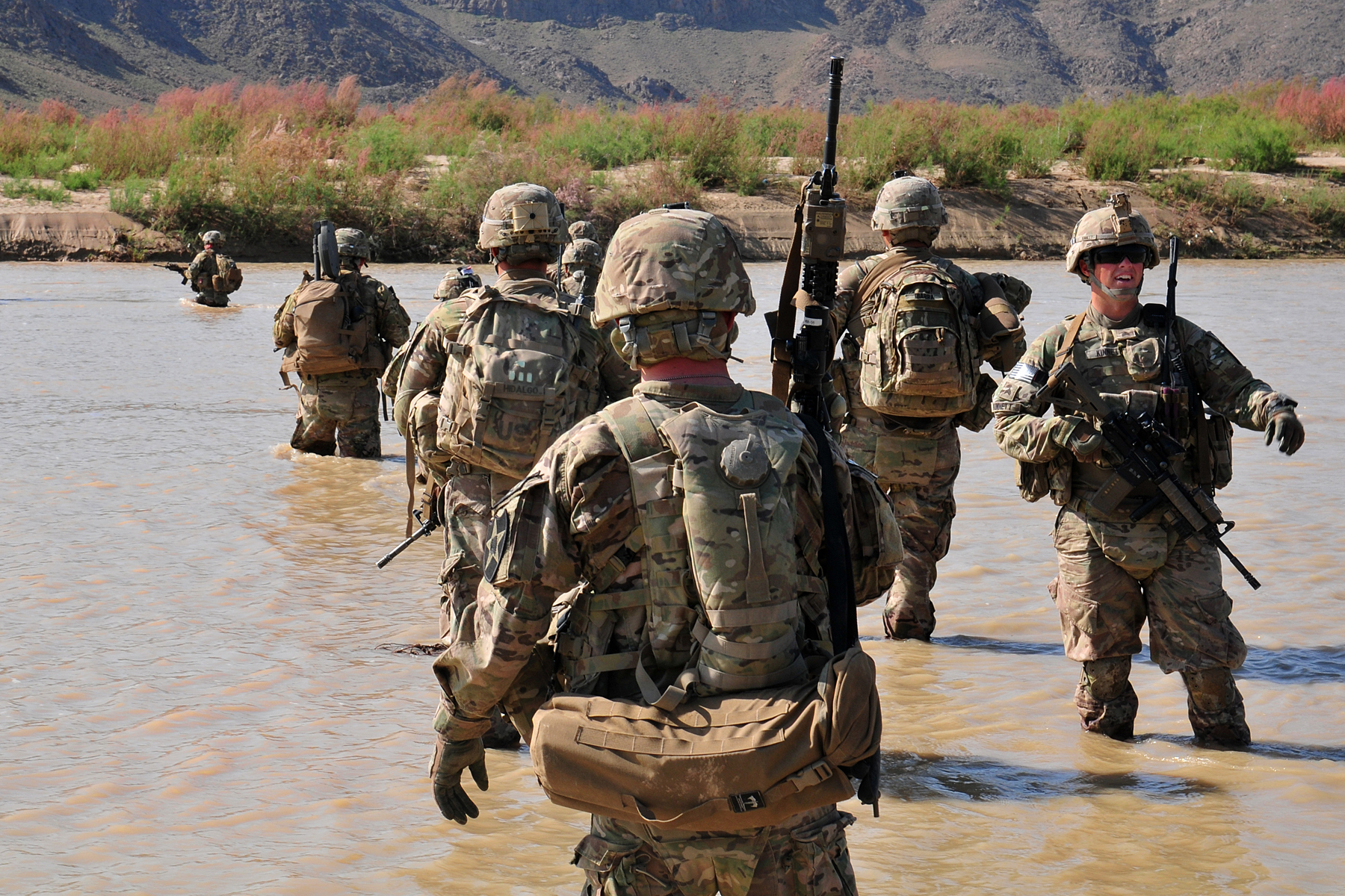 U.S. soldiers cross the Tarnak River in the Panjwai district, Kandahar ...
