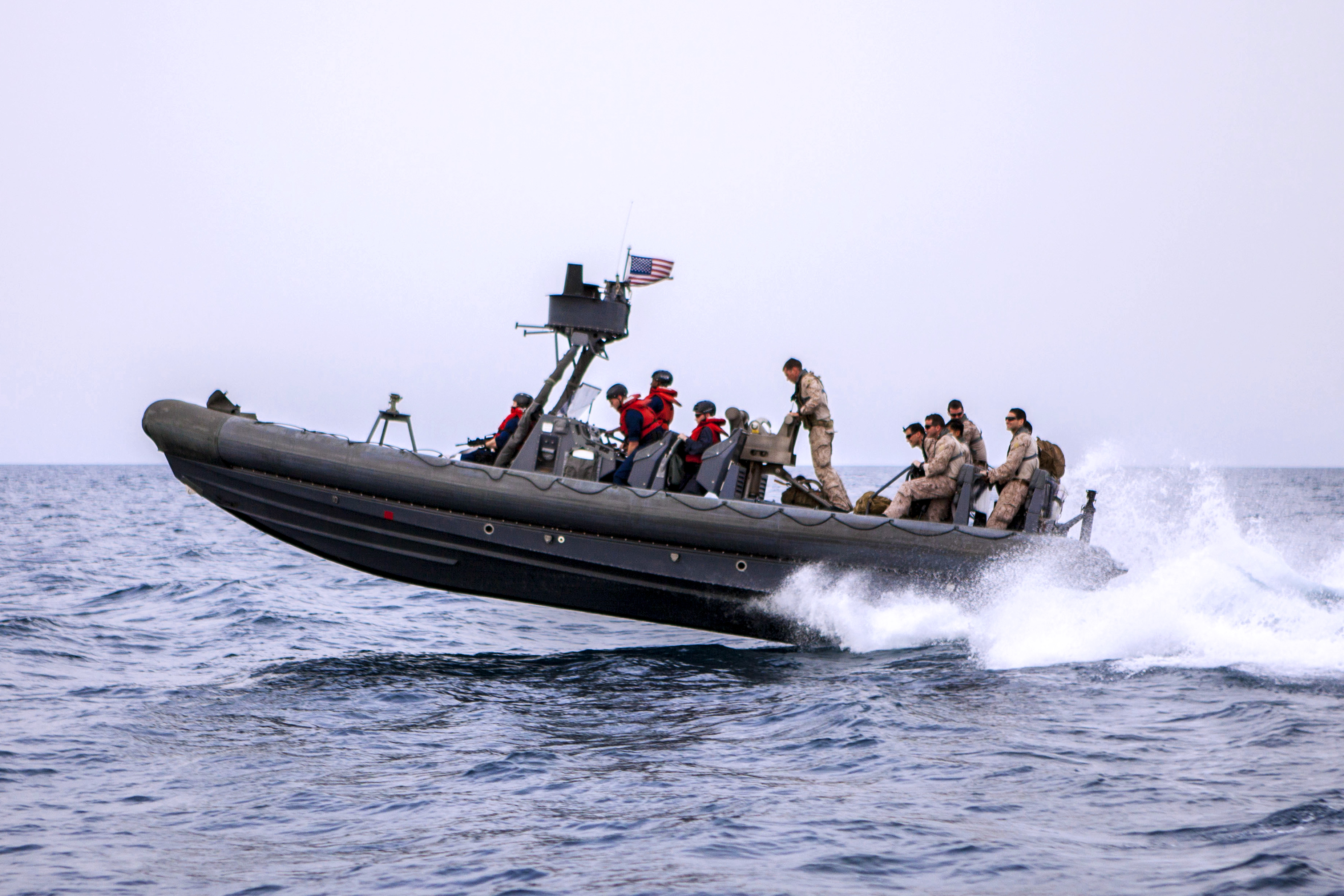 A rigid-hull inflatable boat transports U.S. Marines to conduct scout ...