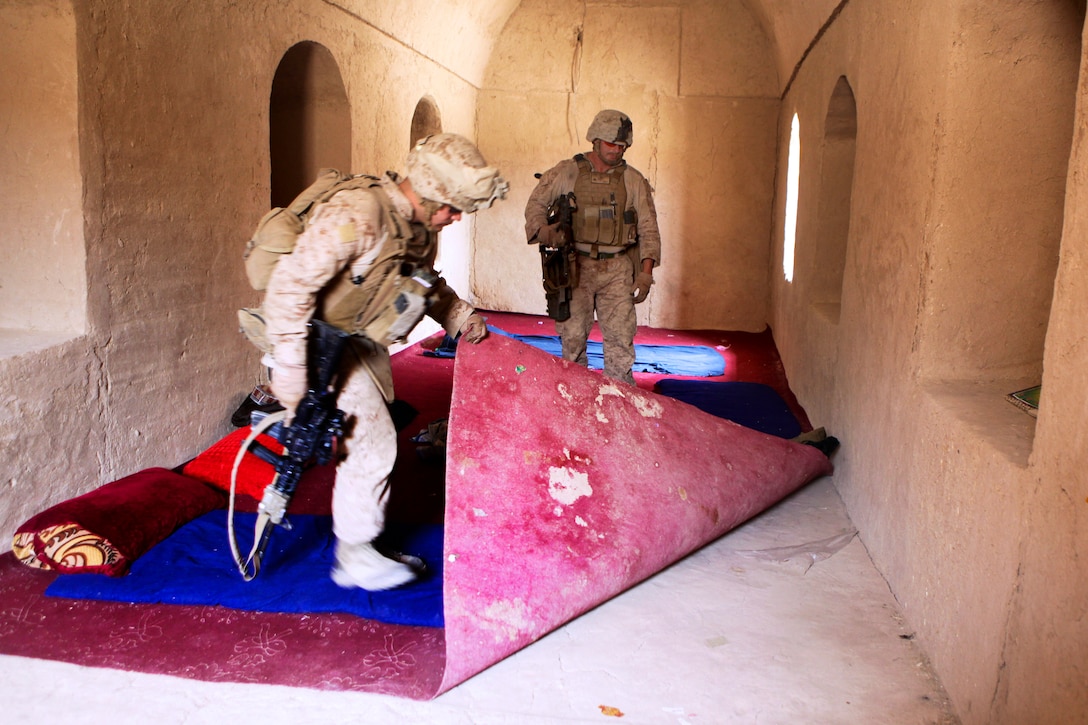 U.S. Marine Corps Staff Sgt. Javier Jimenez, left, and U.S. Marine ...