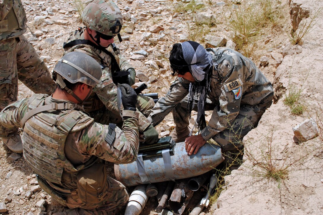 U.S. Air Force Senior Airman Alex Gaunt, left, and U.S. Air Force Staff ...