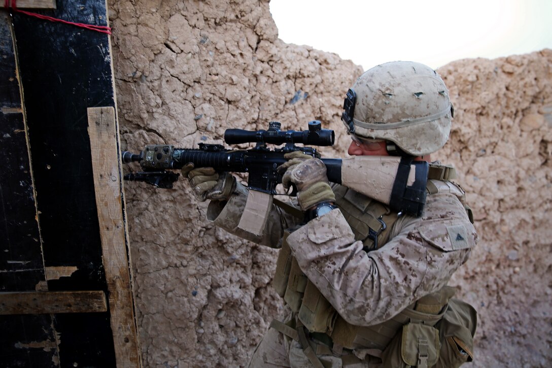 U.S. Marine Corps Lance Cpl. Kaleb Wilson provides security during a ...
