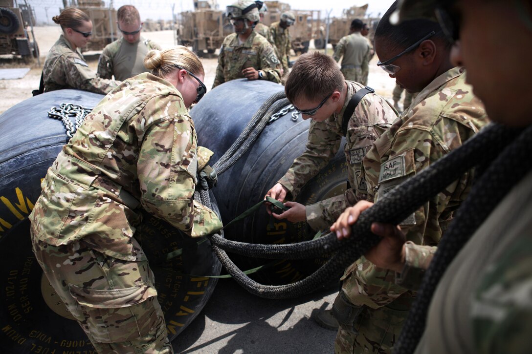 U.S. soldiers prepare two 500-gallon fuel blivets for slingload ...