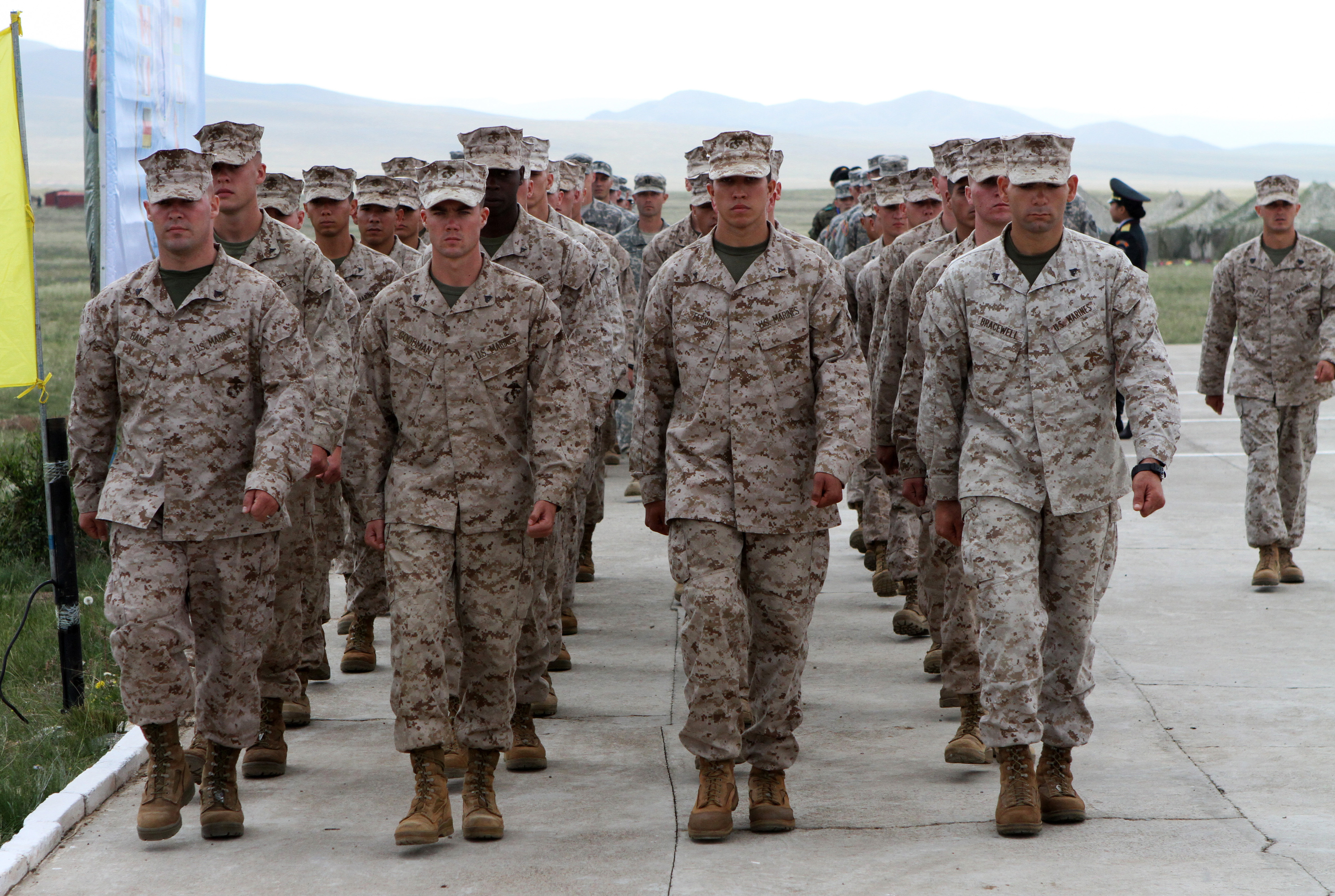 U.S. Marines march in formation during the opening ceremony of Khaan ...