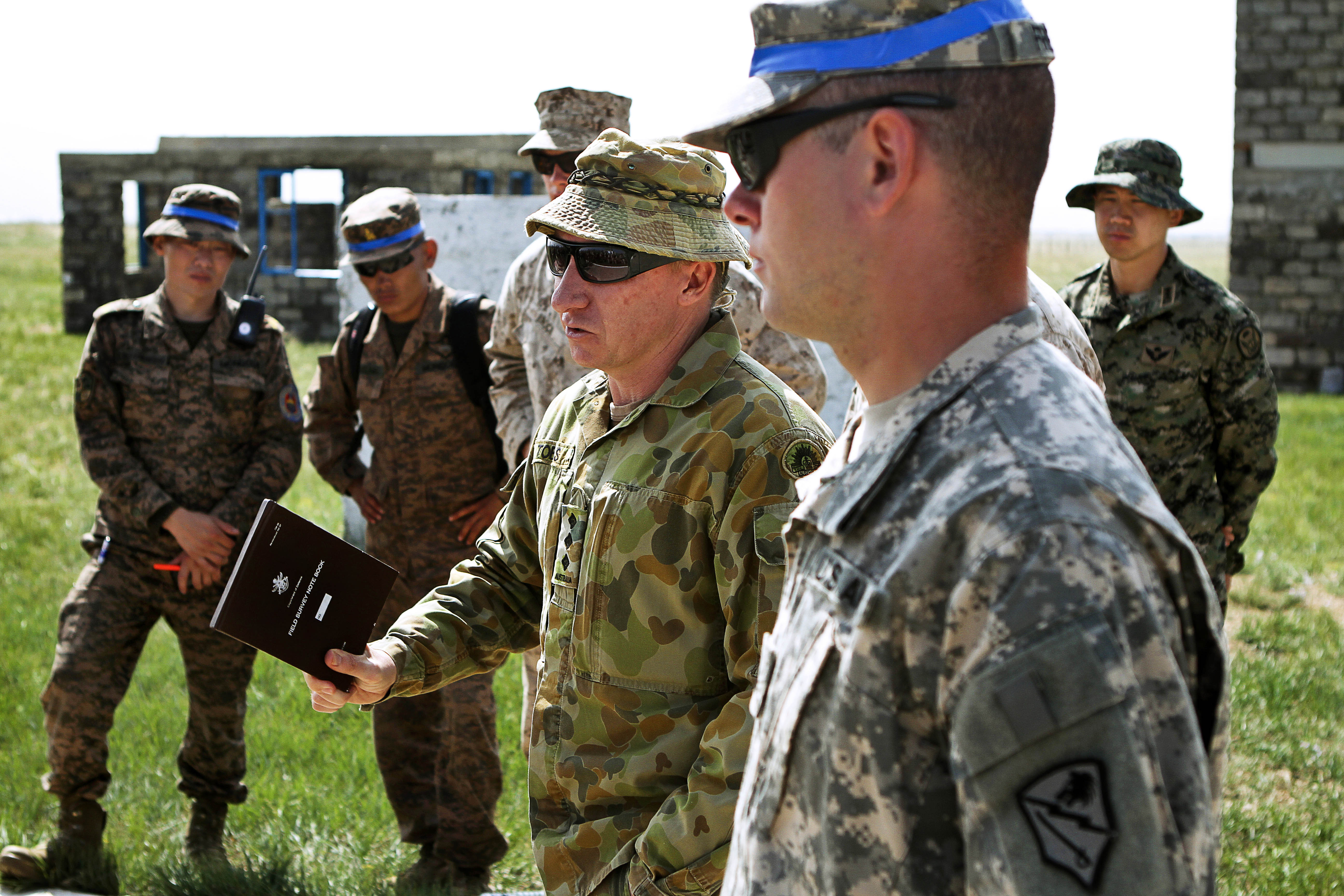 Australian Army Capt. Scott Tobias, center, and U.S. Army Sgt ...