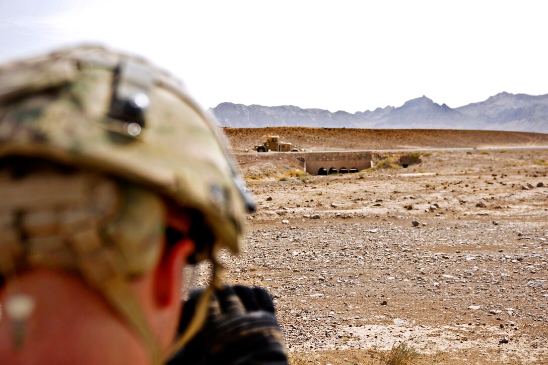 U.S. Army 2nd Lt. Doug Palmer takes a photo from a distance after ...
