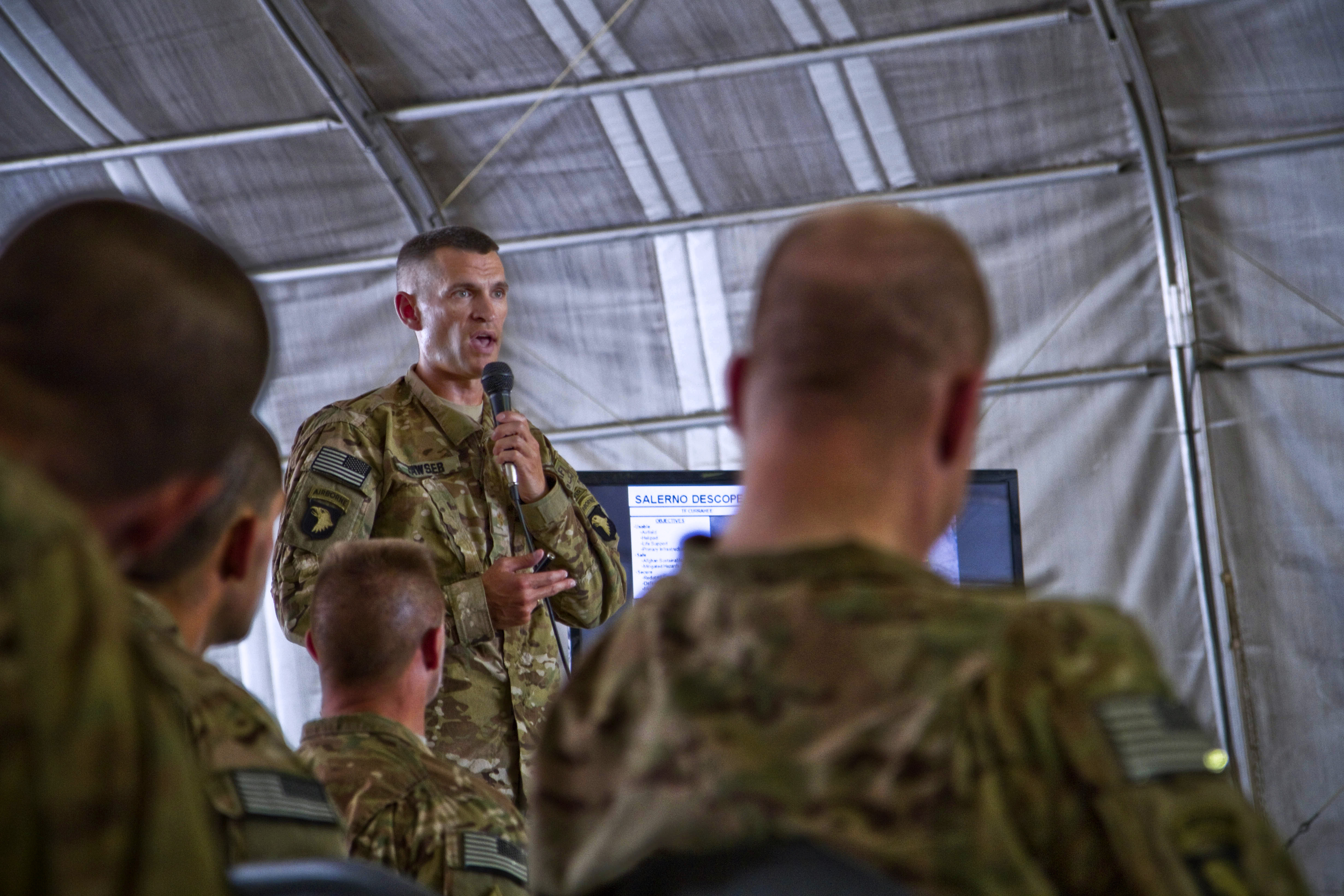 U.S. Army Maj. Brian D. Sawser, center, briefs unit leaders during a ...