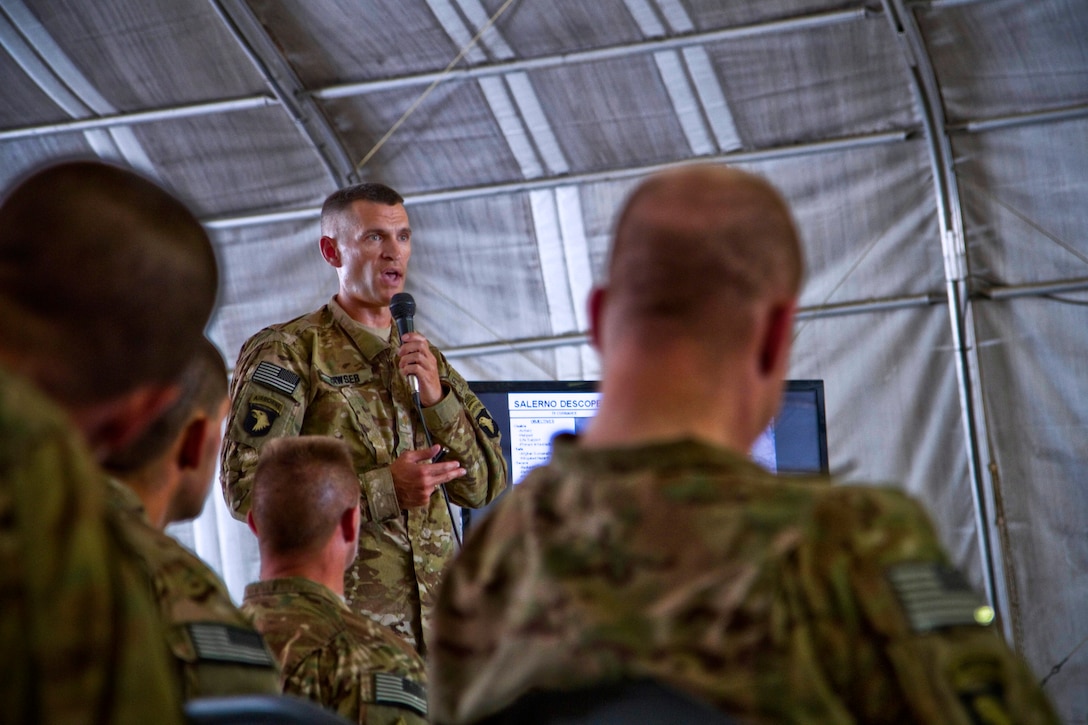 U.S. Army Maj. Brian D. Sawser, center, briefs unit leaders during a ...