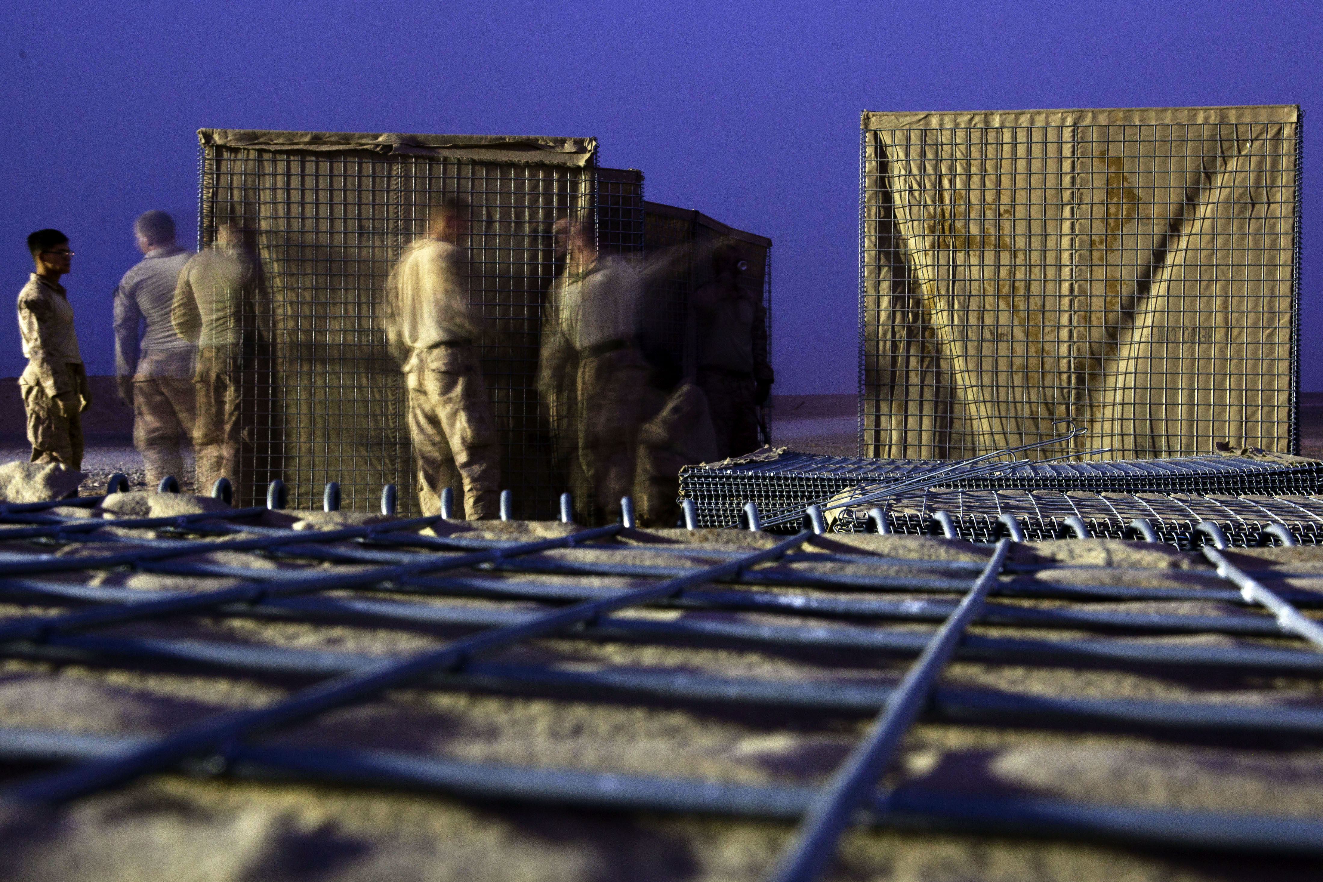 U.S. Marines construct a guard tower on Camp Dwyer in Helmand province ...