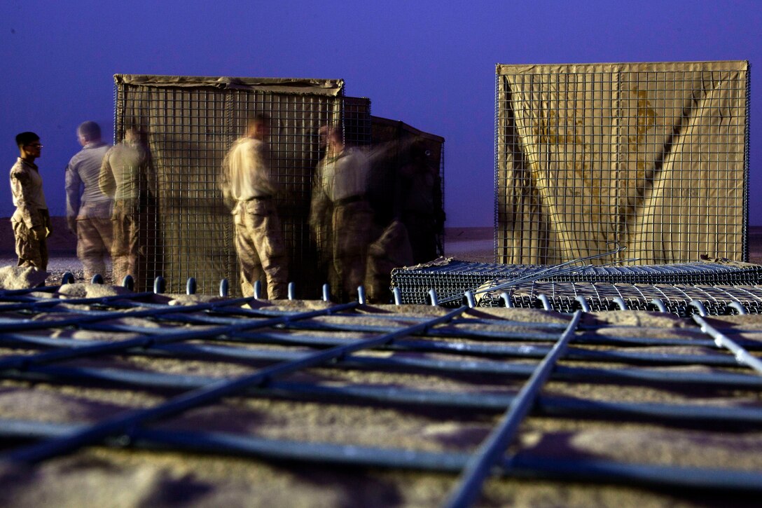 U.S. Marines construct a guard tower on Camp Dwyer in Helmand province ...