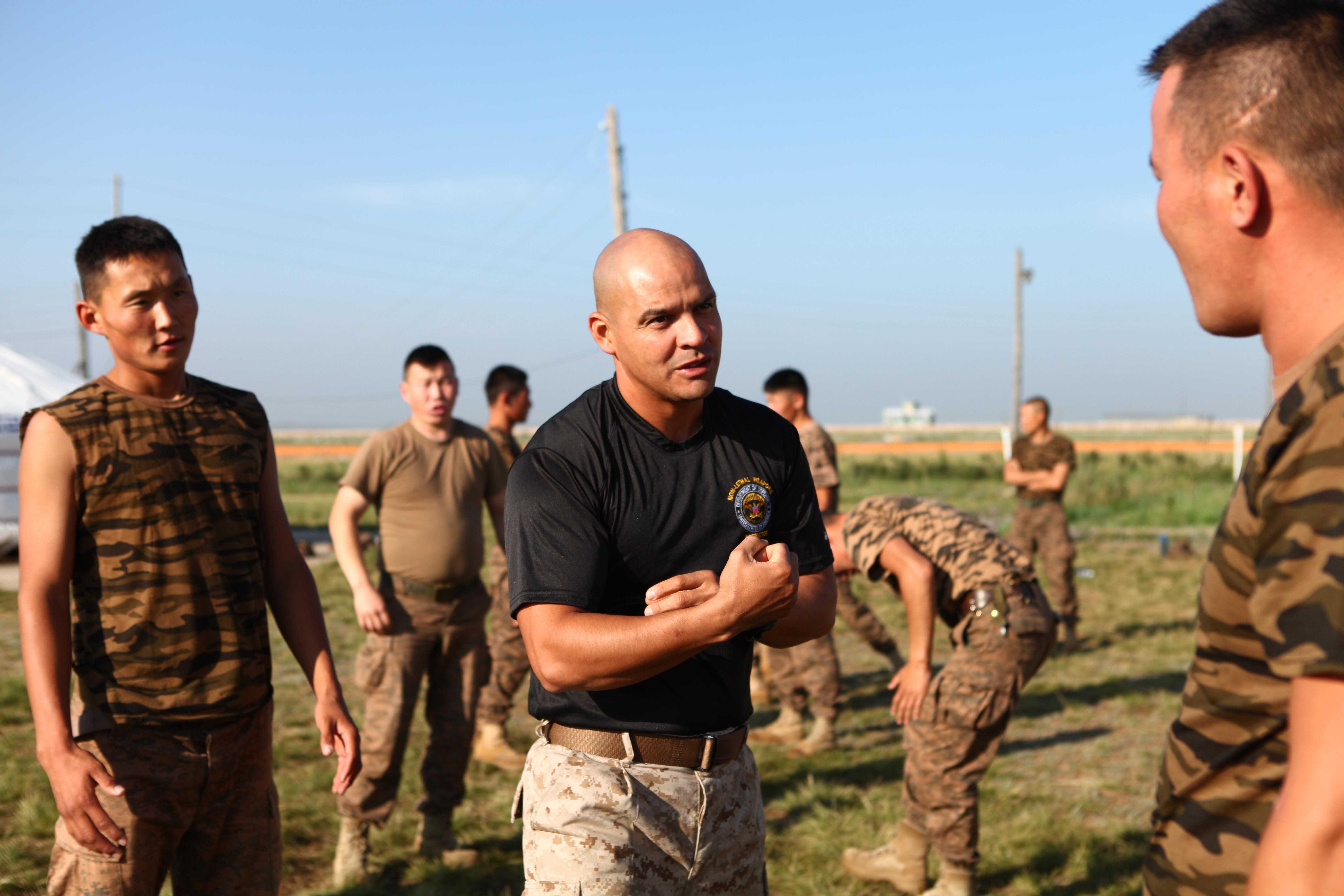 Gunnery Sgt. Alexander Orellana, chief non-lethal weapons instructor ...