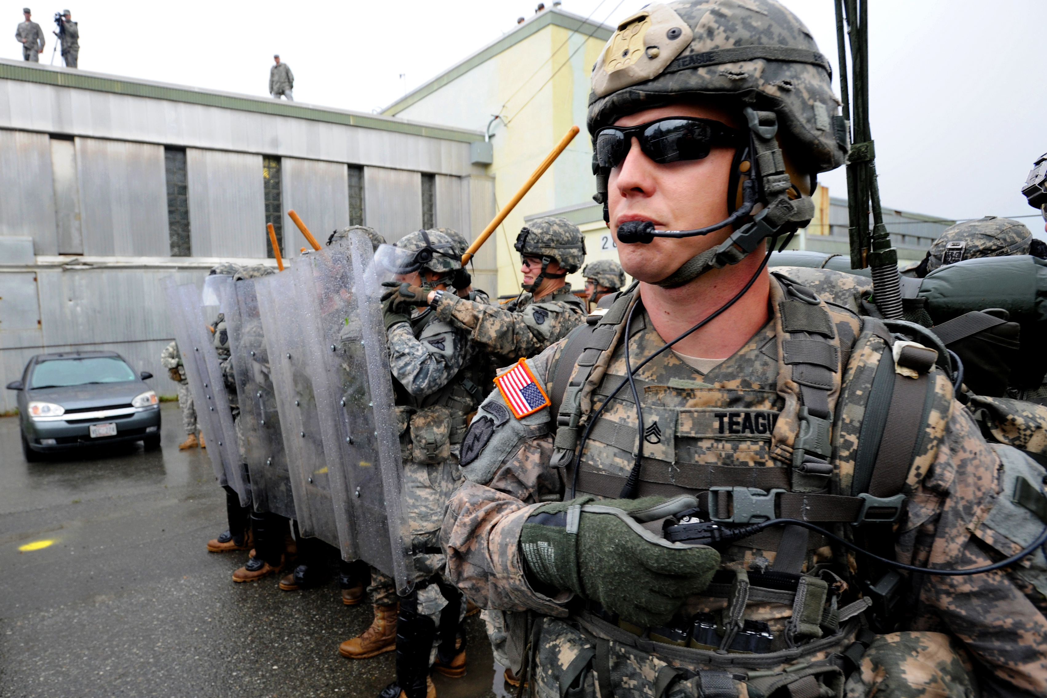 Army Staff Sgt. Homer Teague lines up his soldiers to diffuse a civil ...