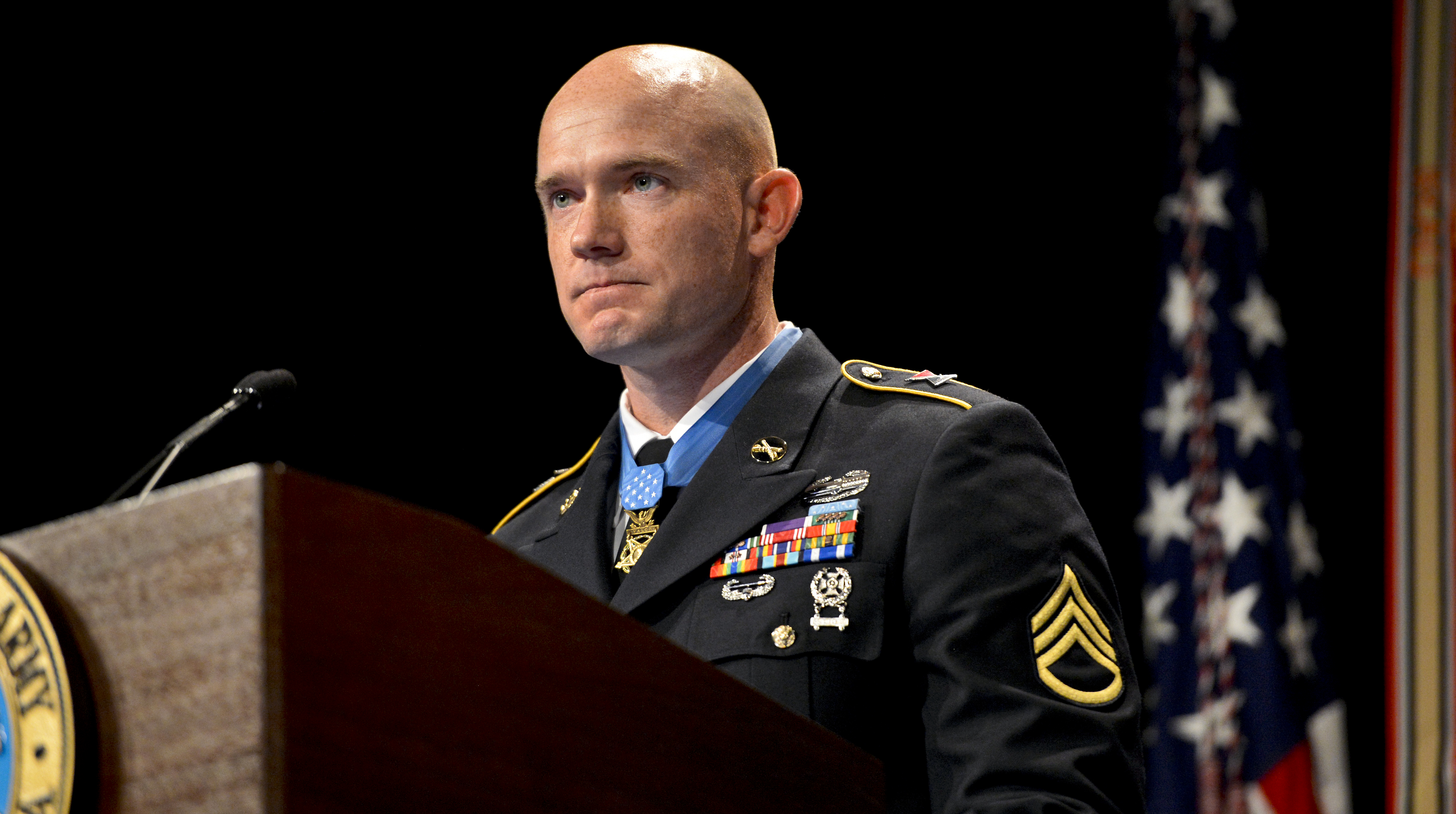 Medal of Honor recipient Army Staff Sgt. Ty Michael Carter holds back ...