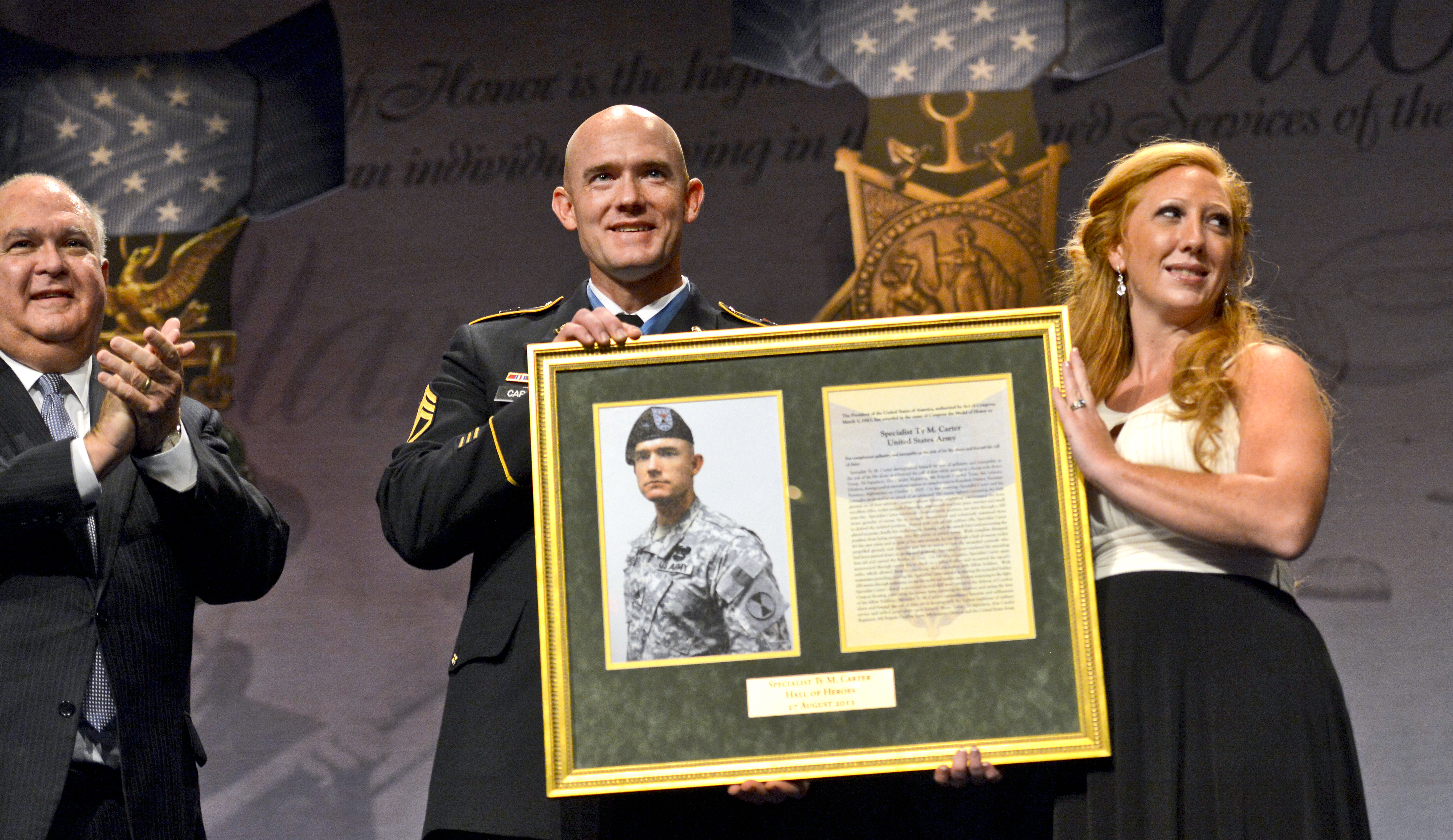Medal of Honor recipient Army Staff Sgt. Ty Michael Carter and his wife ...
