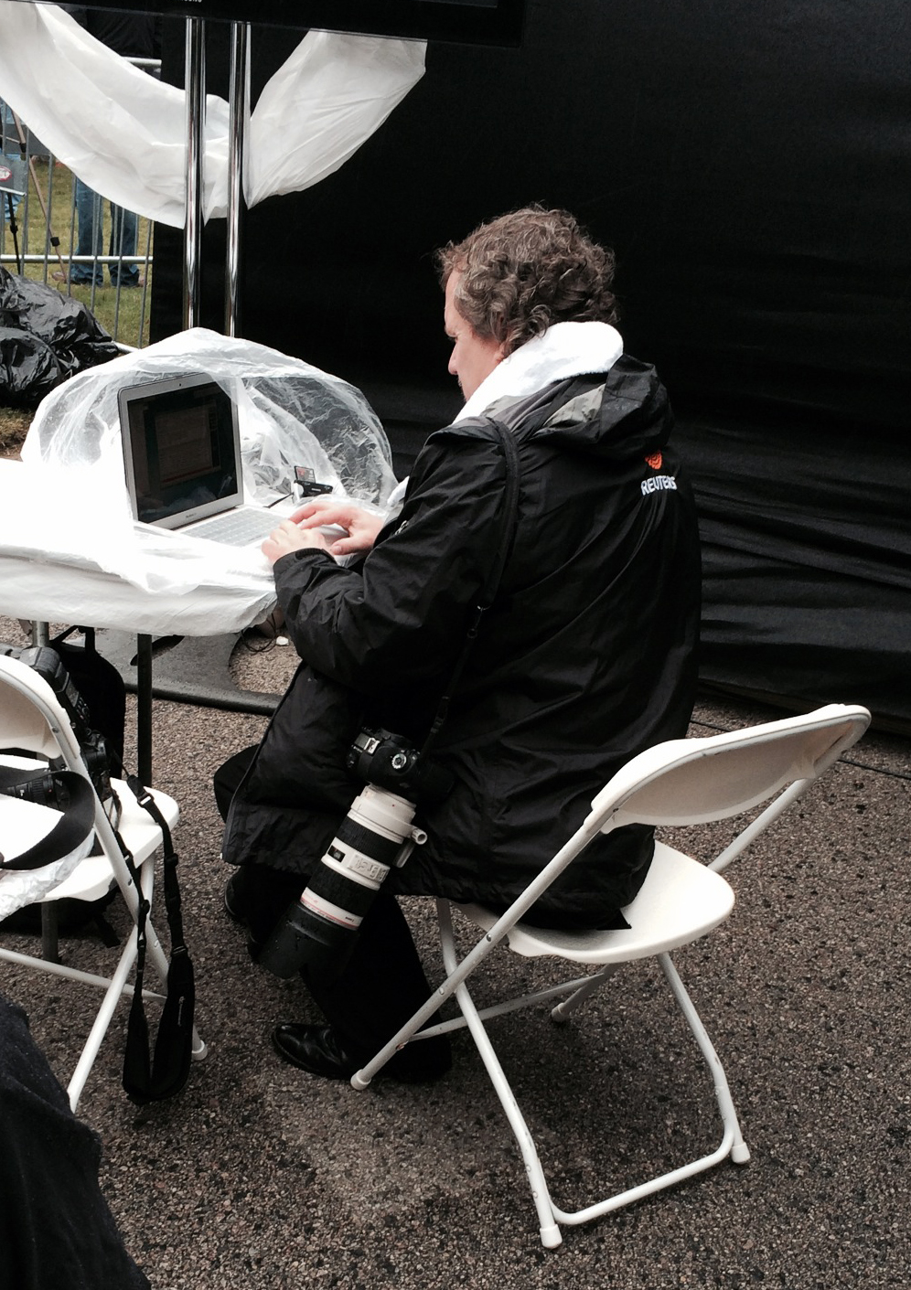 Filing a story in the cold and rain