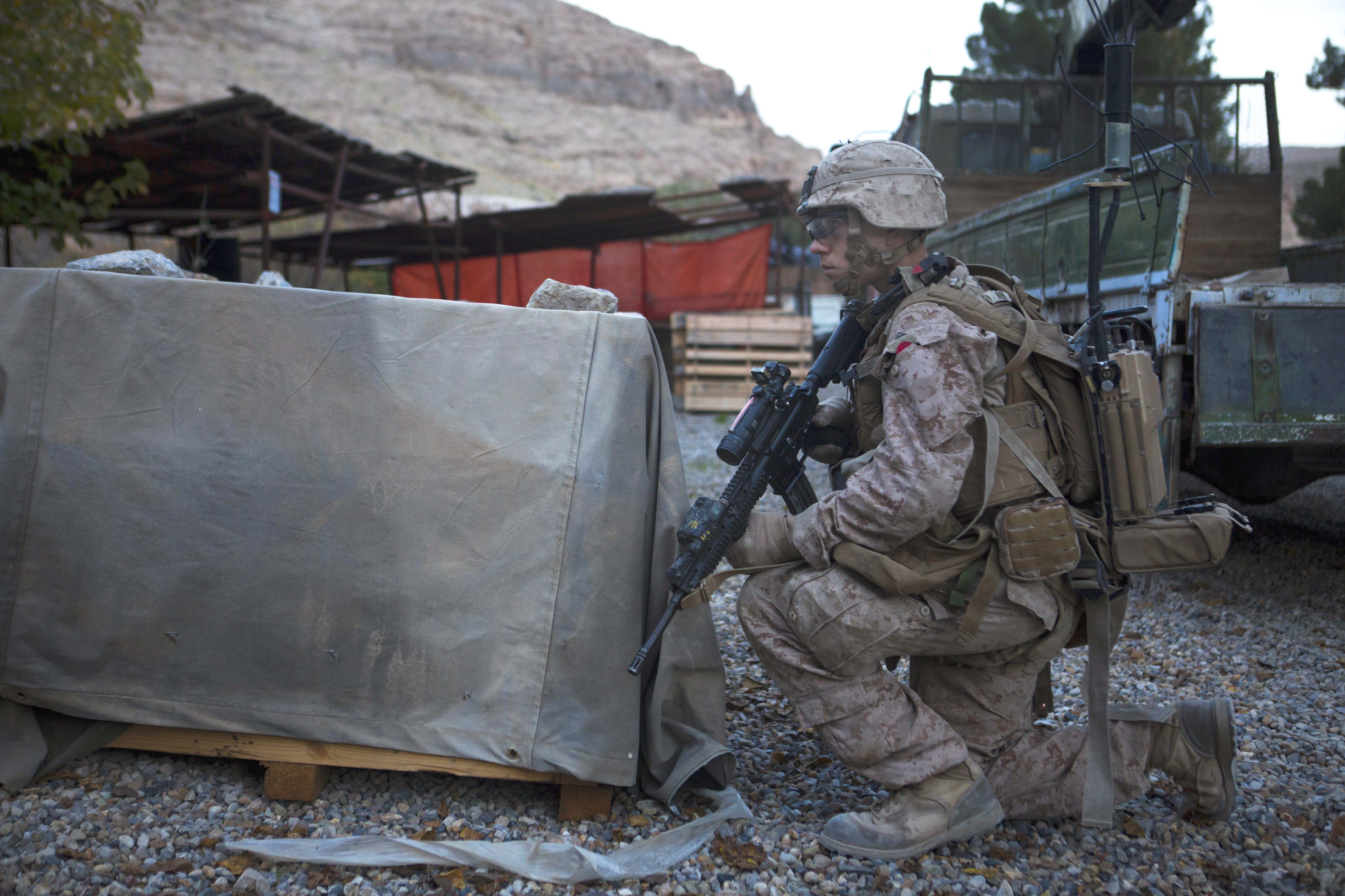 U.S. Marine Corps Lance Cpl. Andrew Moreno provides security during a ...