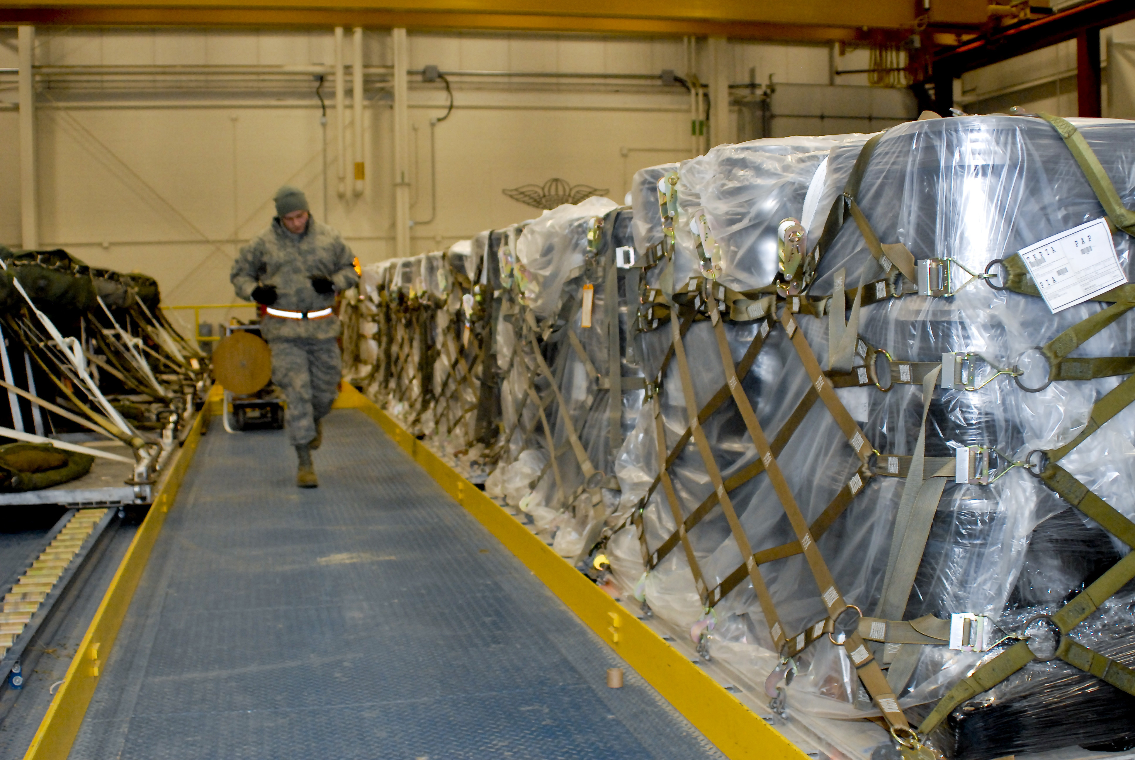 182nd Logistics Readiness Squadron airmen load relief cargo for Haiti