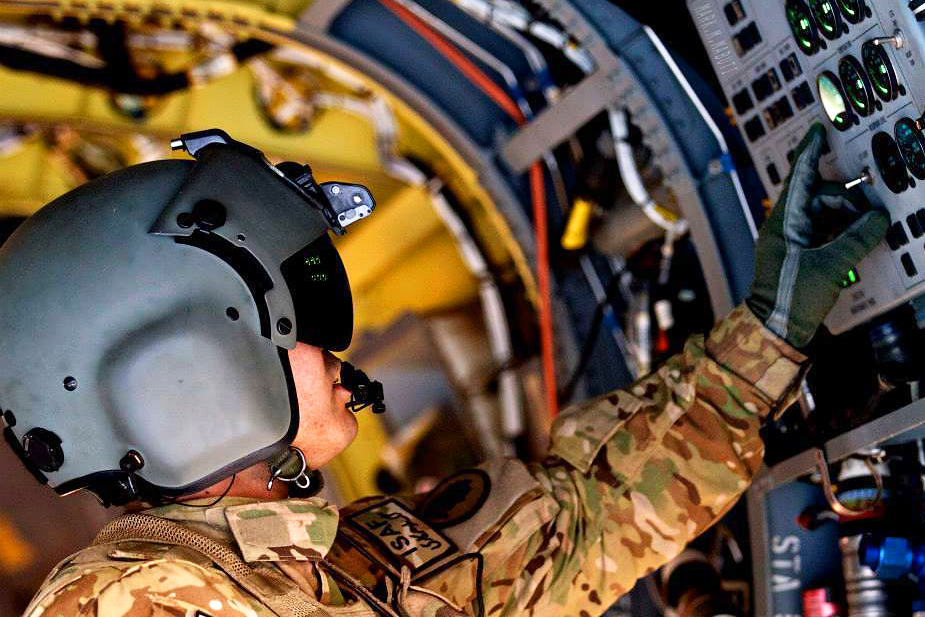 U.S. Army Sgt. Van Shiroma monitors a maintenance instrument panel on ...