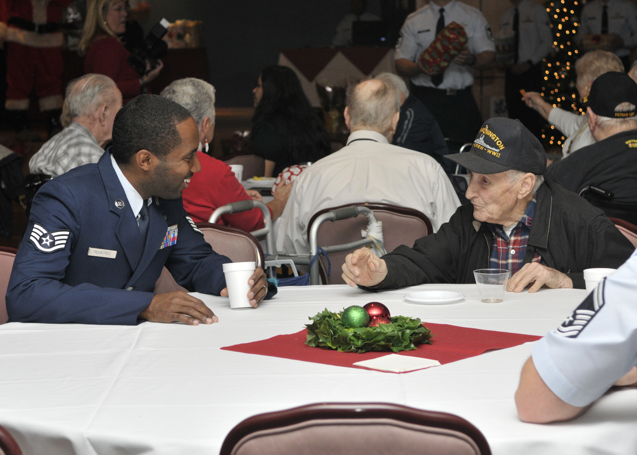 Airman talks to senior citizen