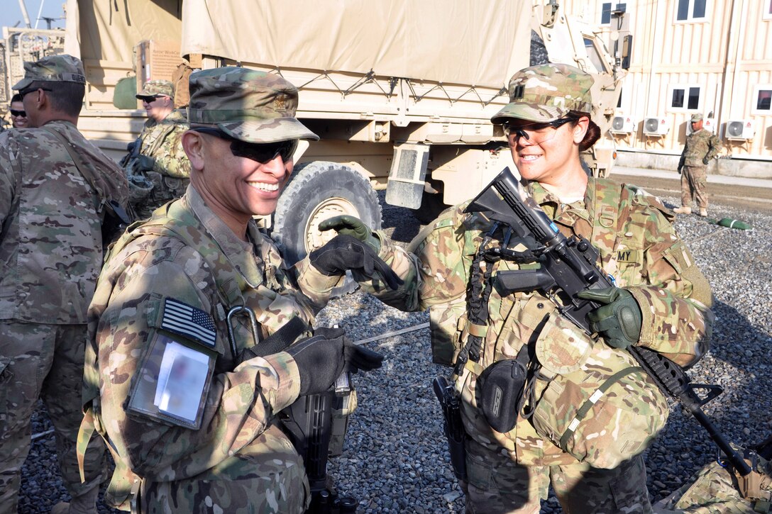 U.S. Army Maj. Rickey M. Flores, left, and U.S. Army Capt. Stephanie L ...