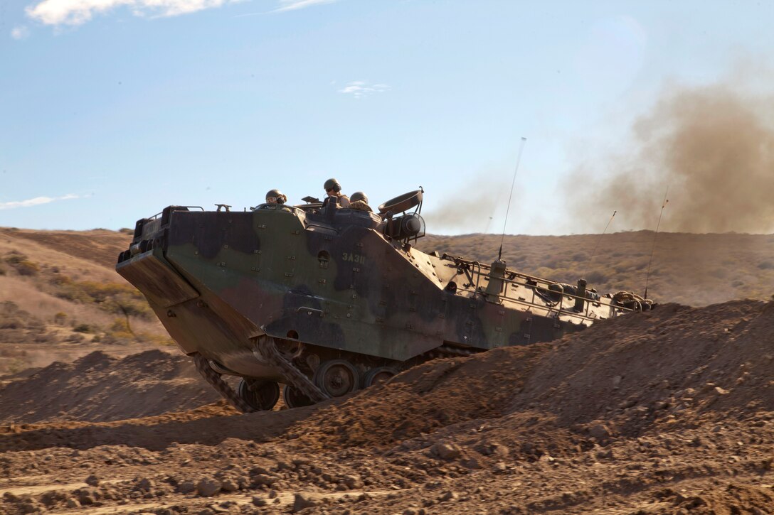 A Marine Corps AAV7A1 assault amphibious vehicle assigned moves towards ...